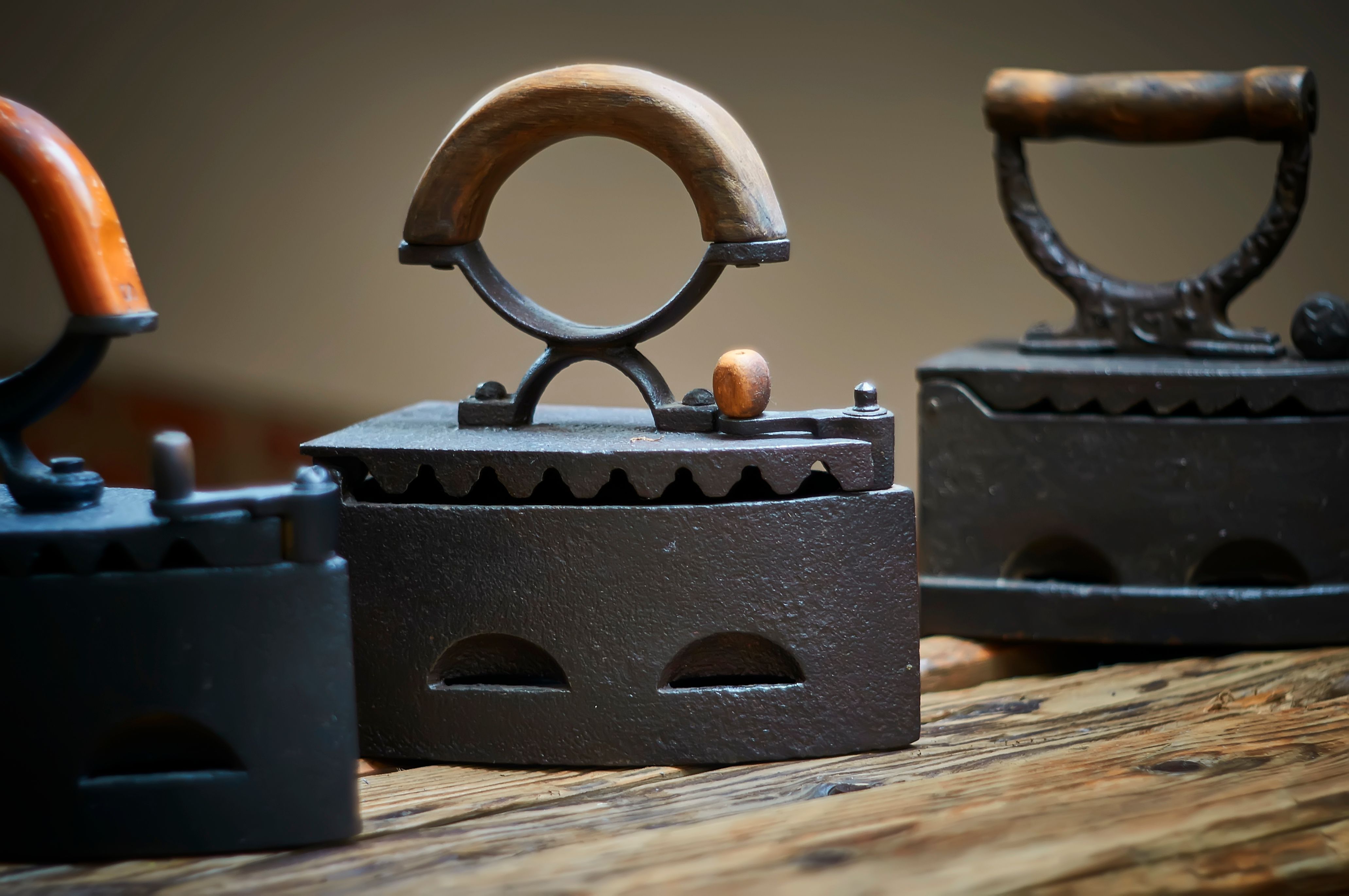 A collection of antique iron cookware · Free Stock Photo