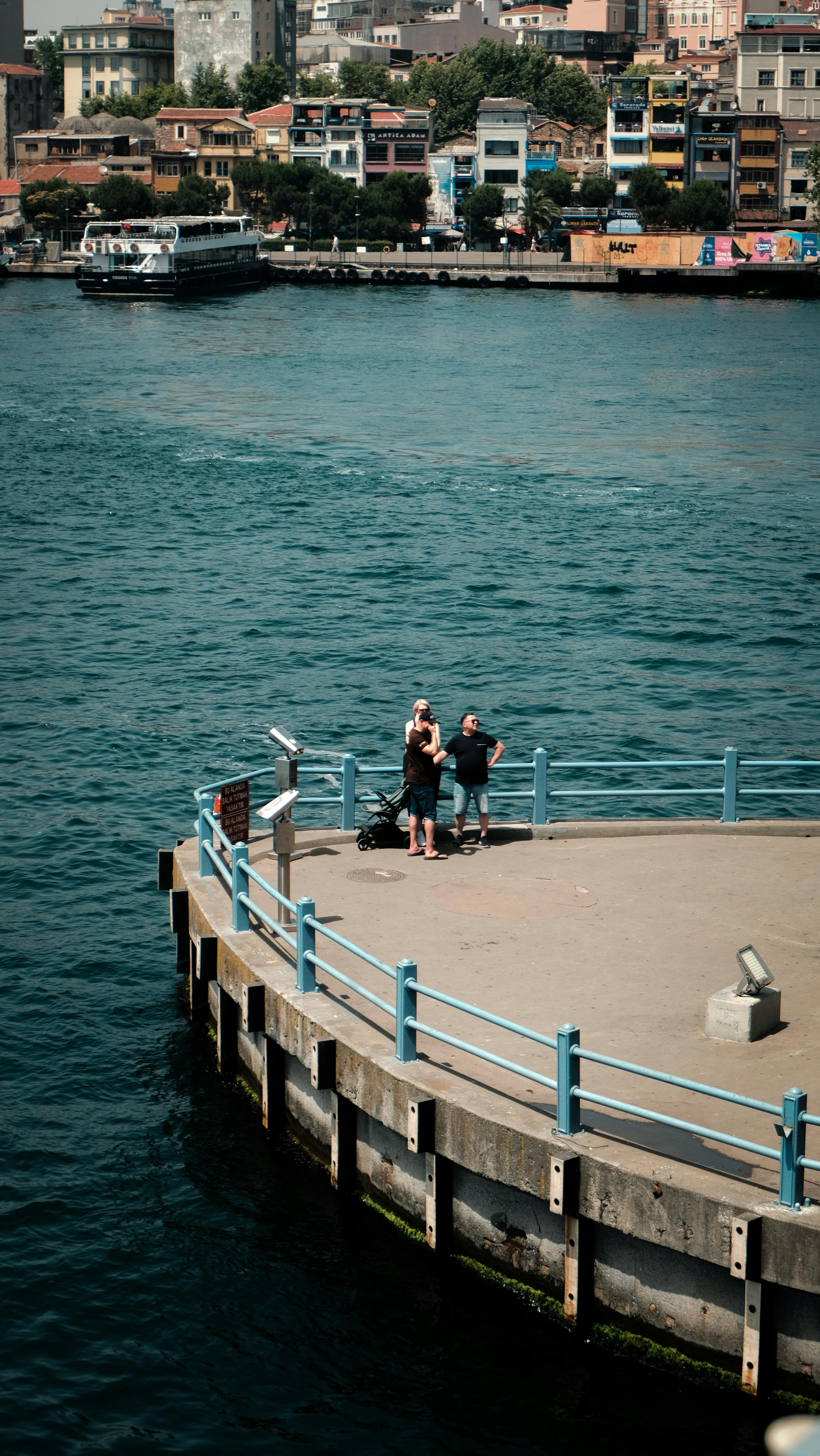 Men on Pier by Bosporus Strait in Istanbul, Turkey · Free Stock Photo