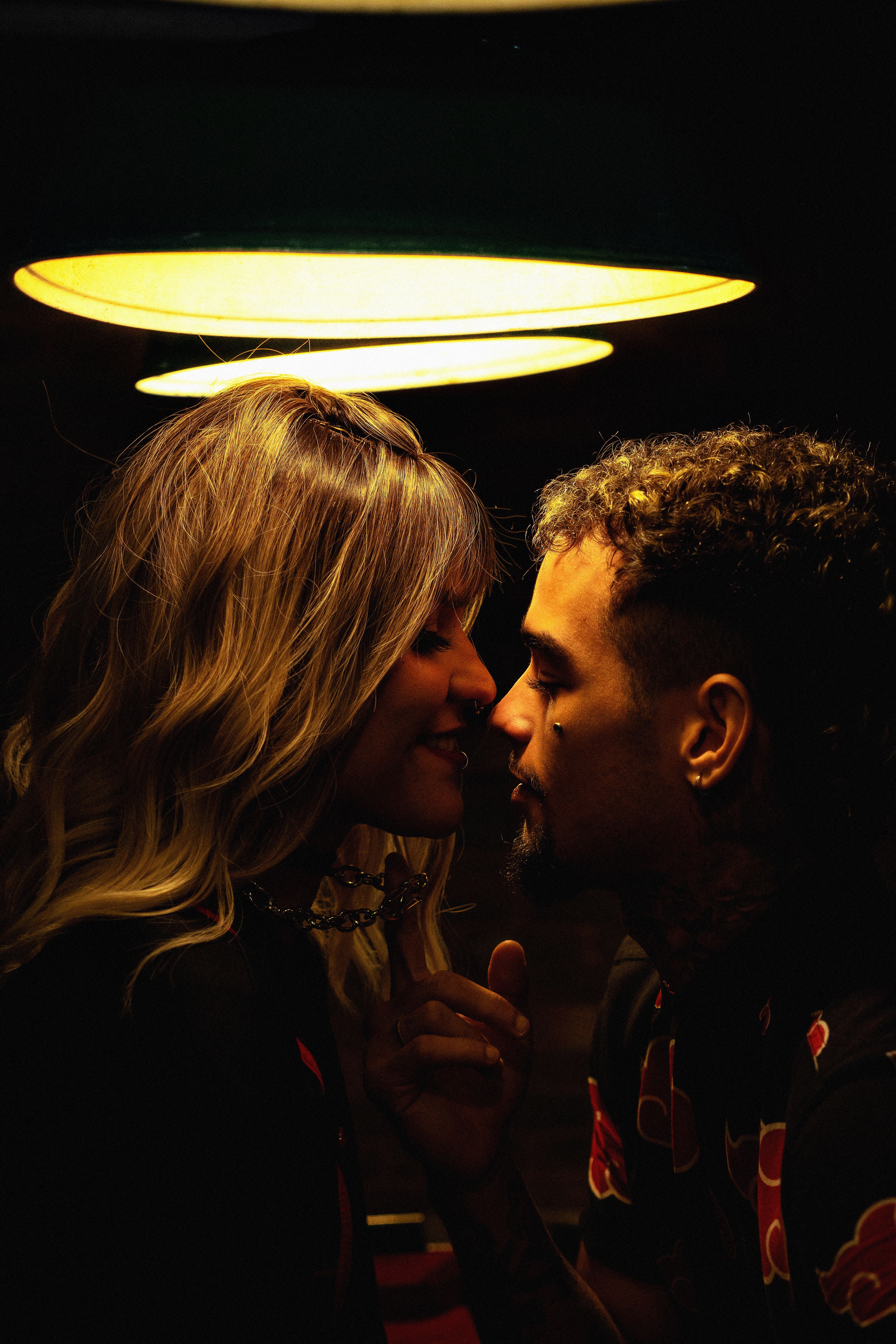 Couple Kissing under Lit of Lamp · Free Stock Photo