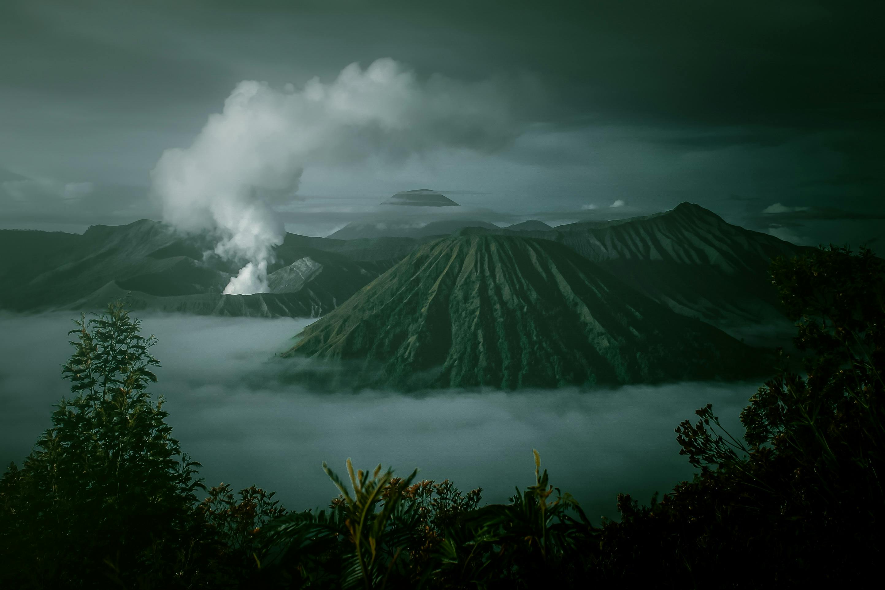 Volcanoes Under Grey Sky · Free Stock Photo