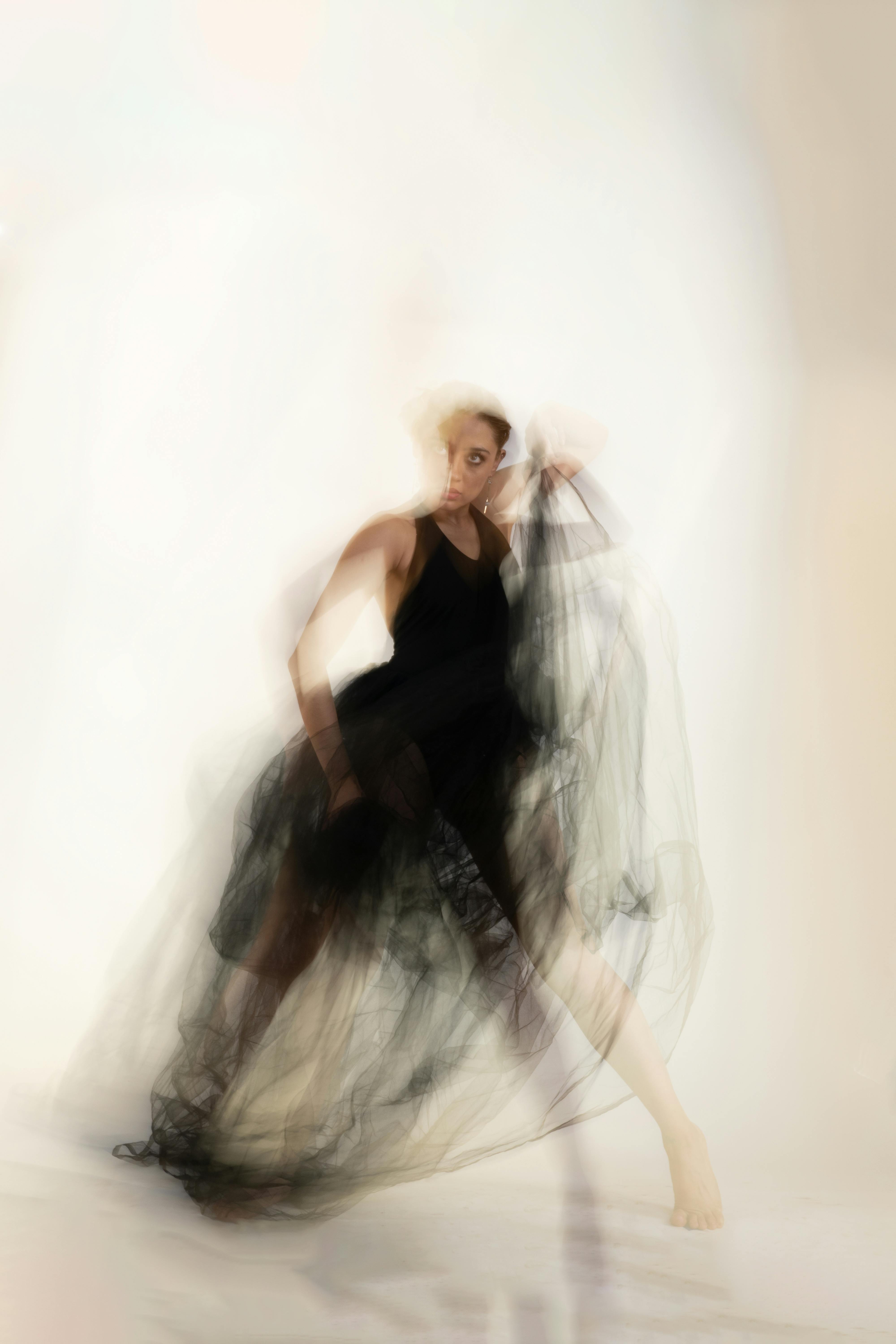 Dancing Woman in Black Dress · Free Stock Photo