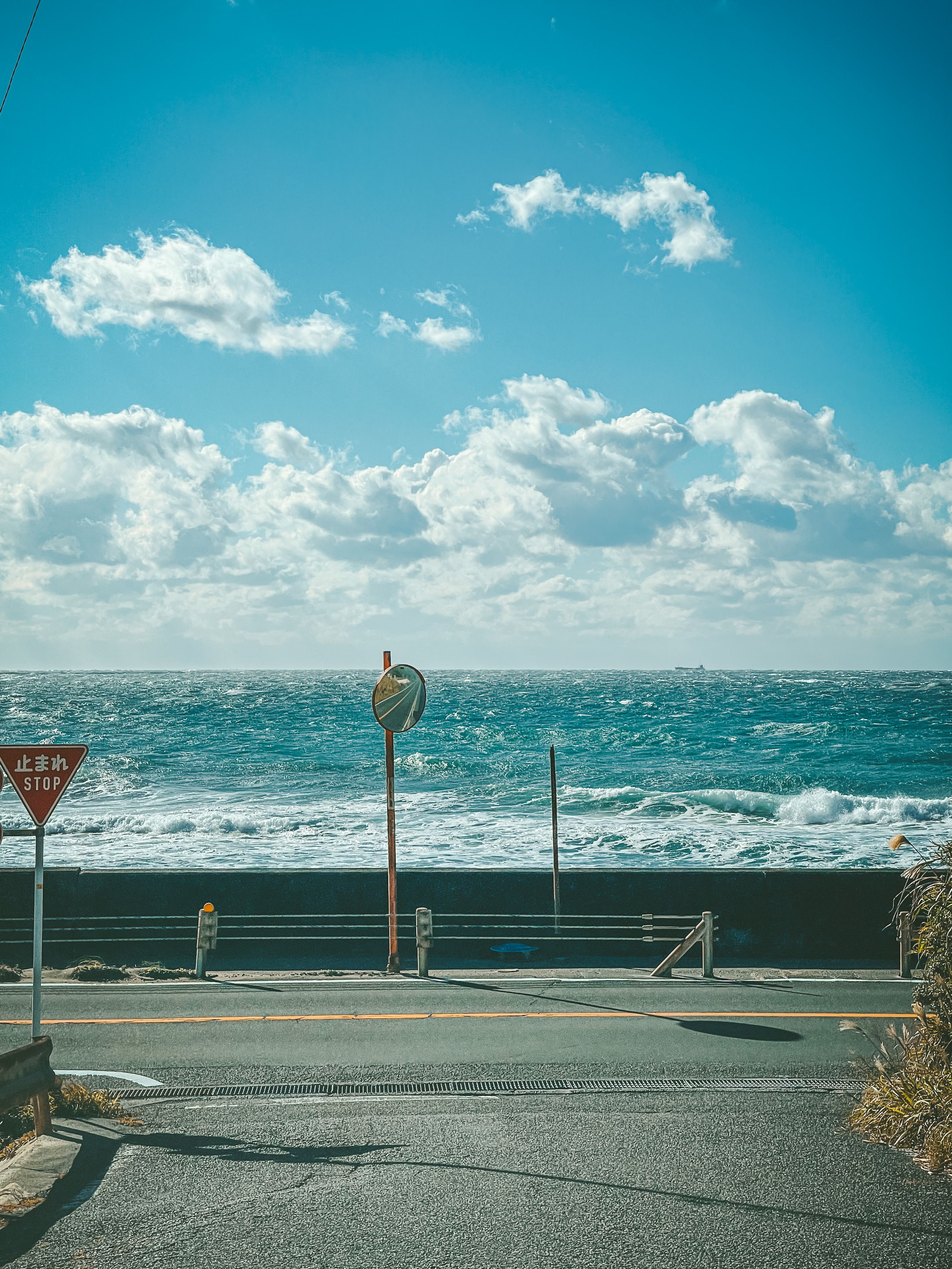 Stop Sign and Mirror on Road on Sea Shore · Free Stock Photo