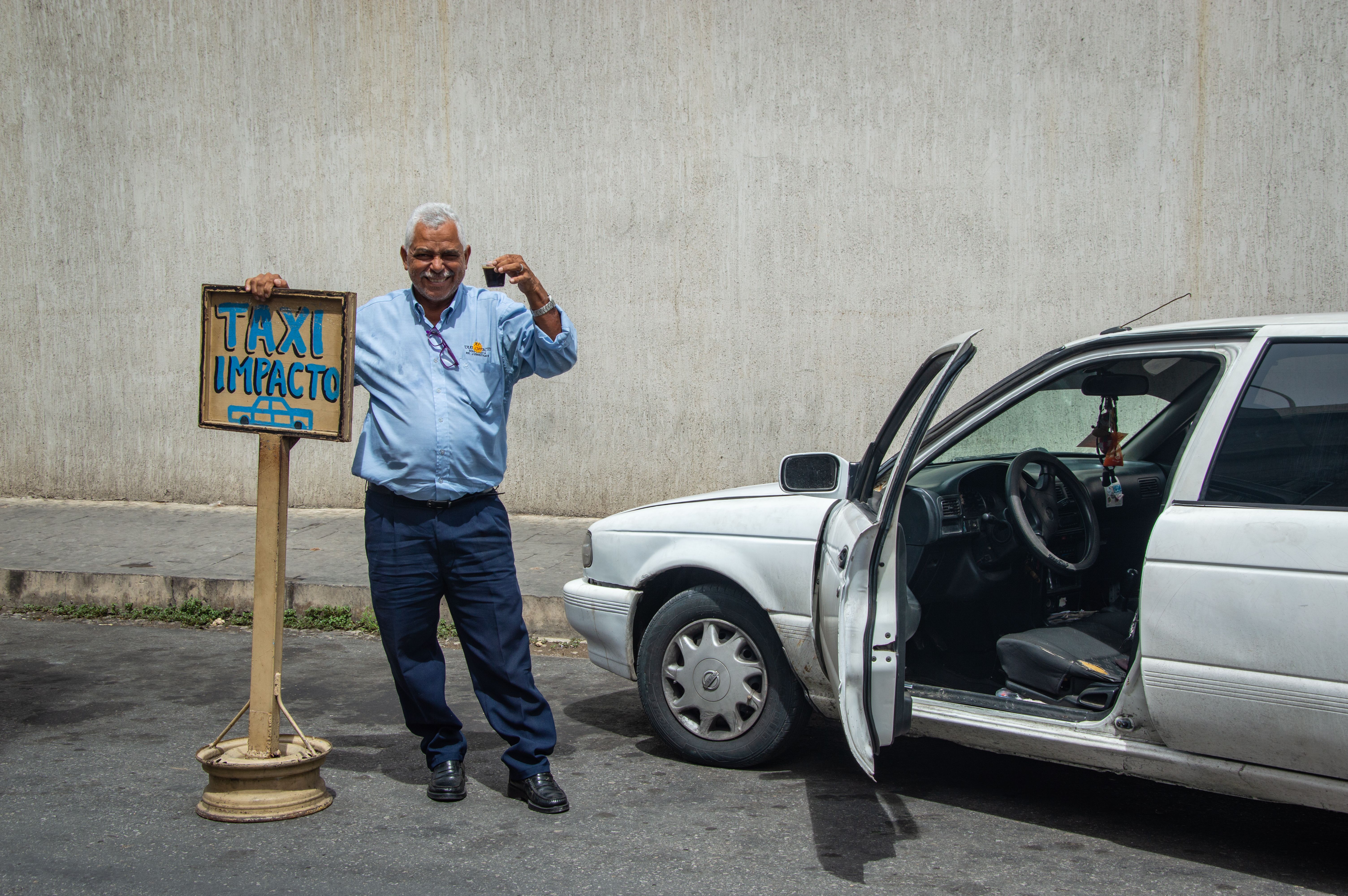 Taxi Driver with a Sign · Free Stock Photo