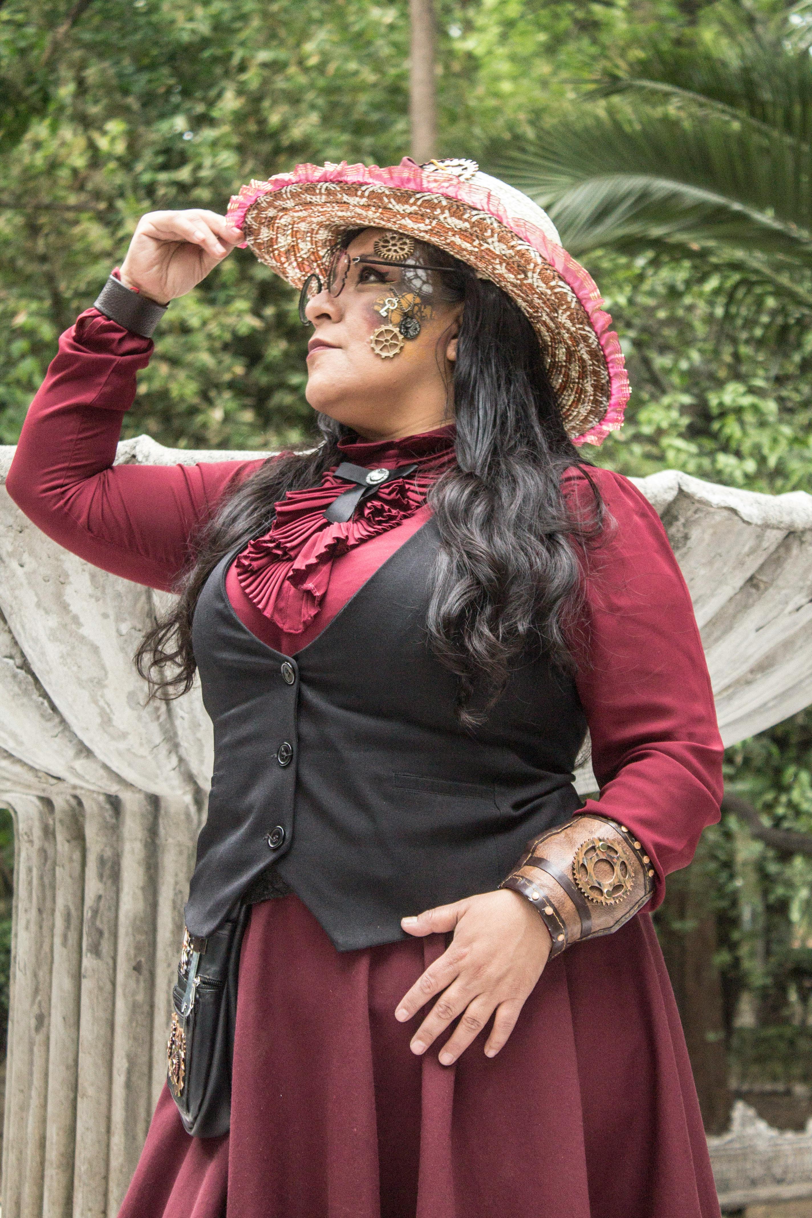 A Woman Wearing a Steampunk Costume Posing Outside · Free Stock Photo