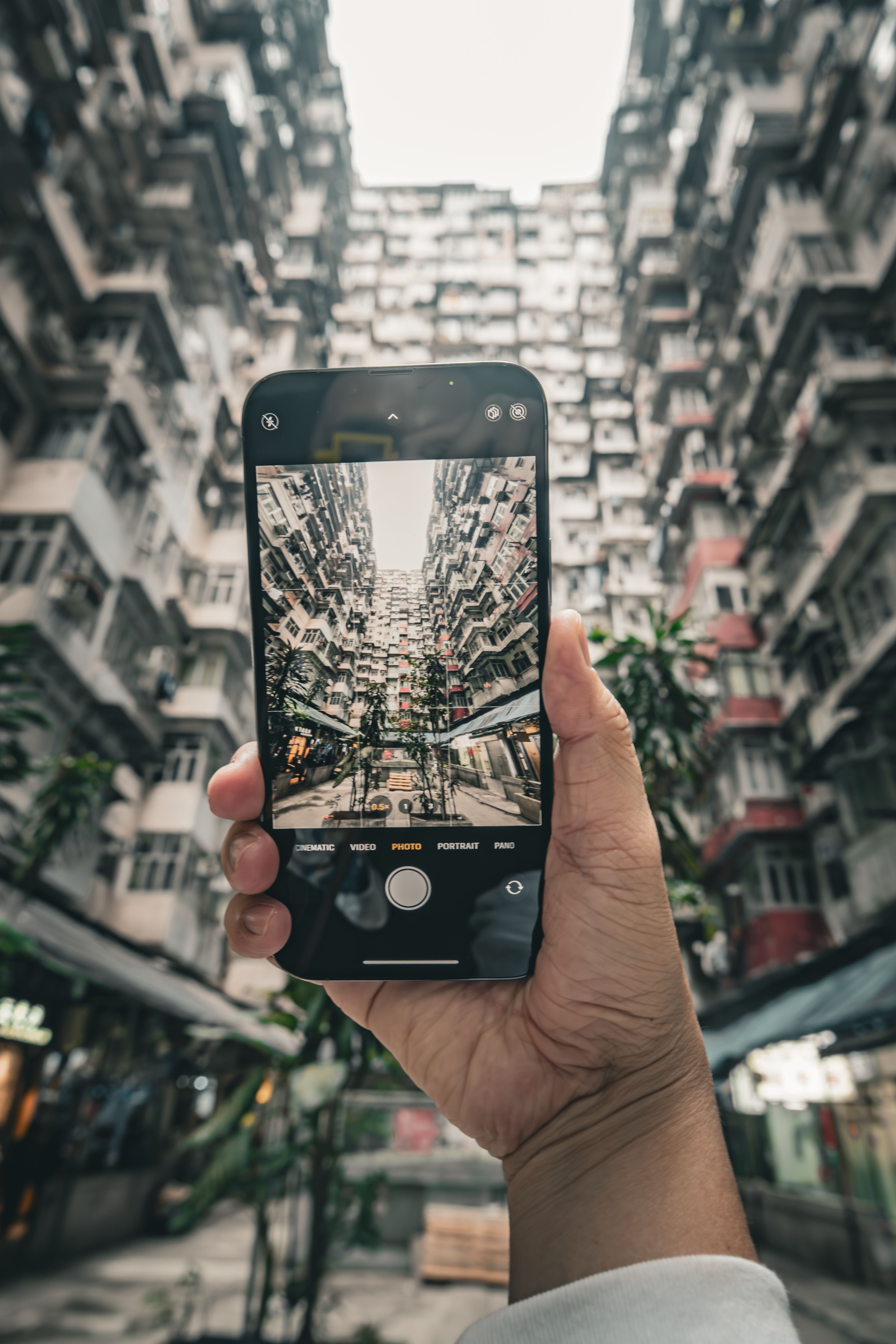Close-up of a Man Taking a Picture with a Smartphone of the Yick Cheong ...