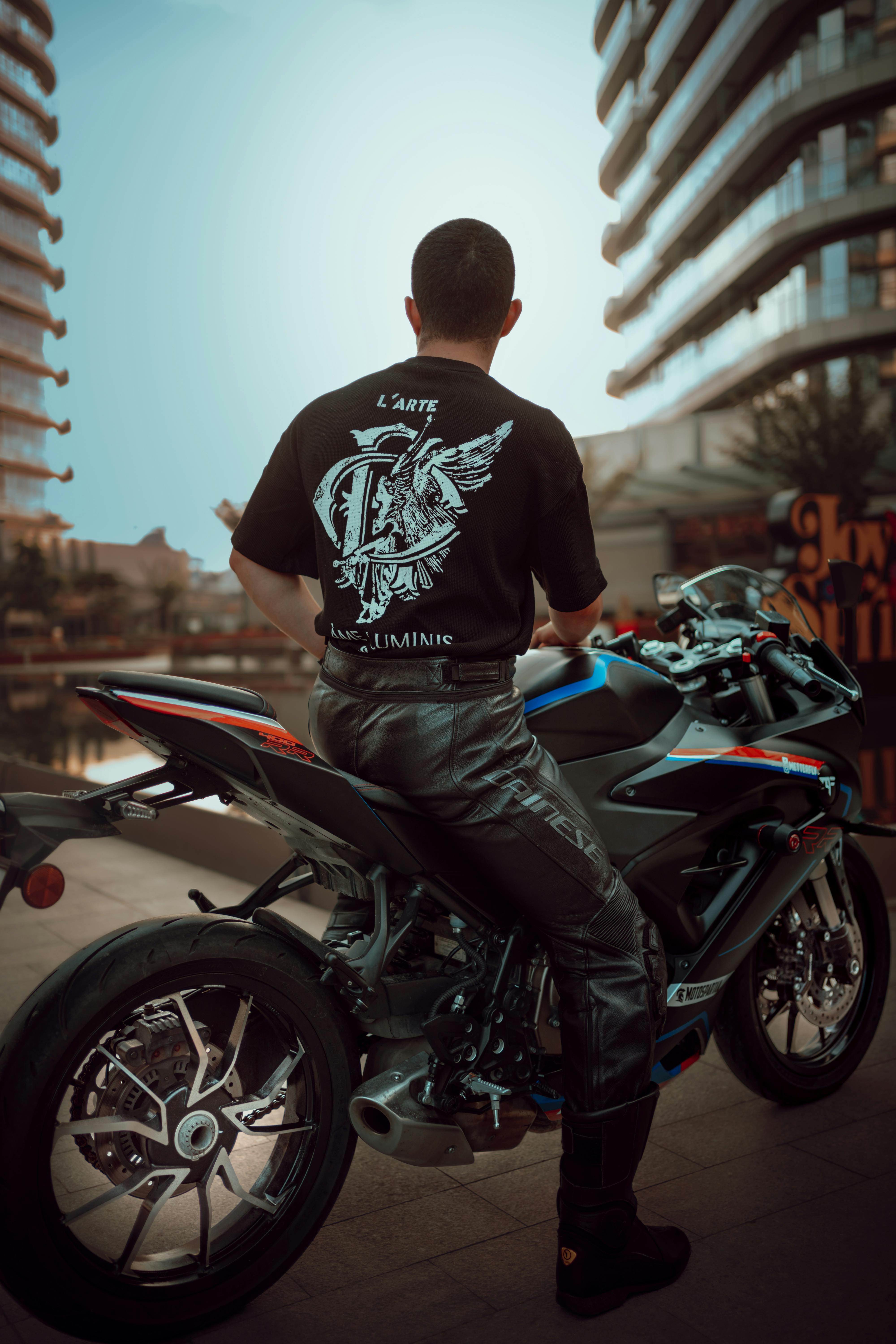Back View of a Man Sitting on a Motorcycle · Free Stock Photo