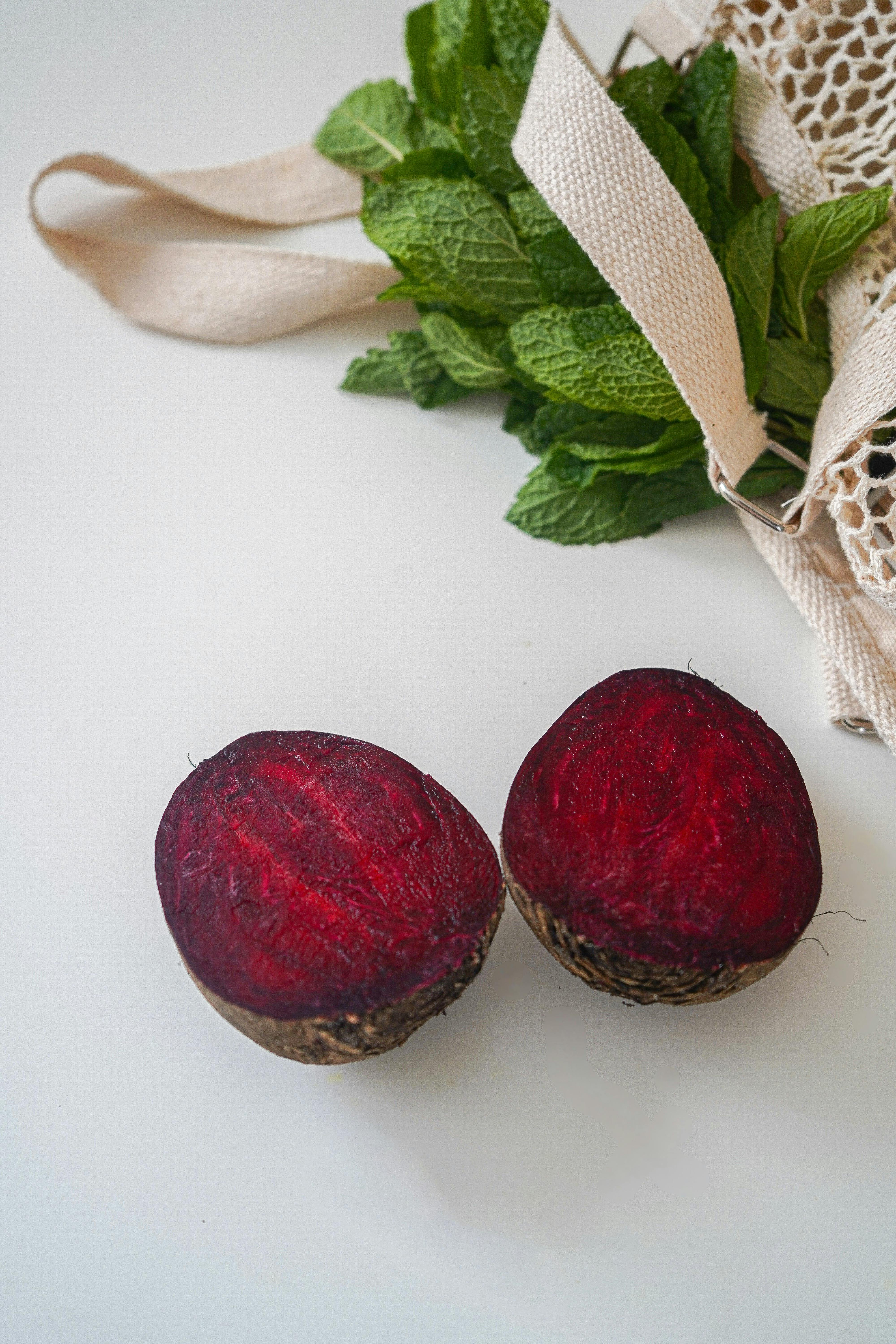 Halves of Beet on White Table · Free Stock Photo