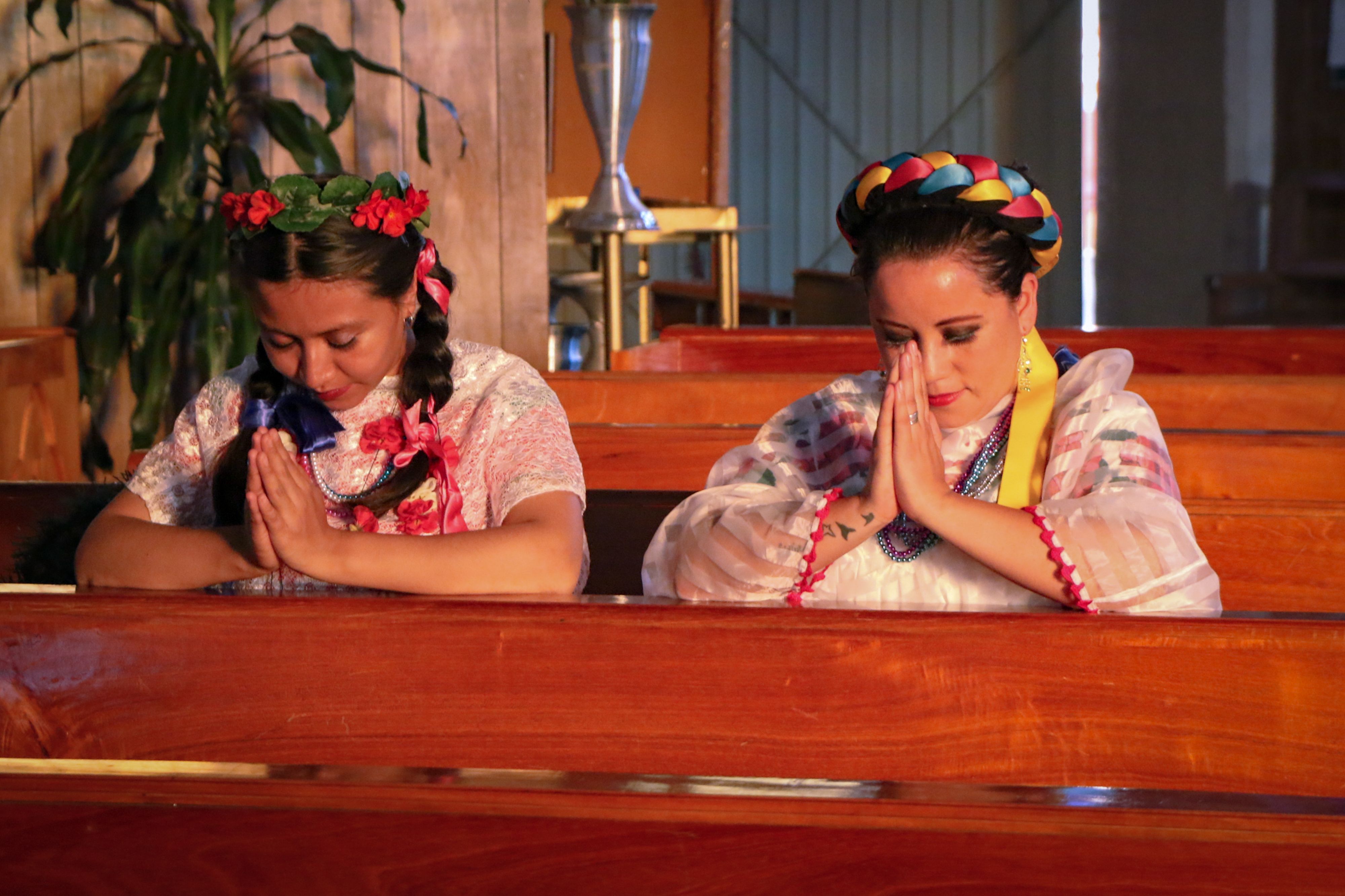 Women in Folklore costumes Praying in Church · Free Stock Photo