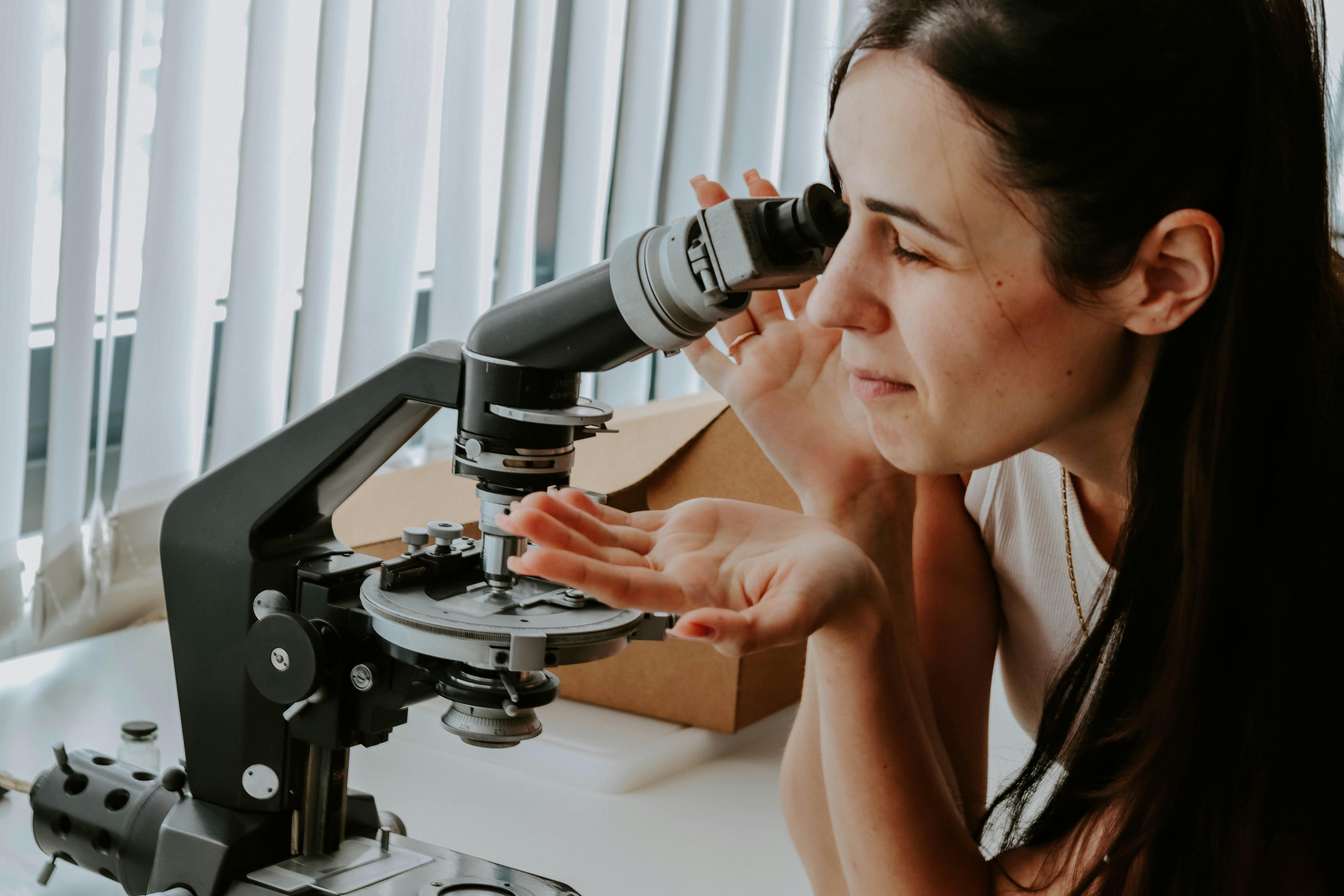 Woman Using Microscope · Free Stock Photo