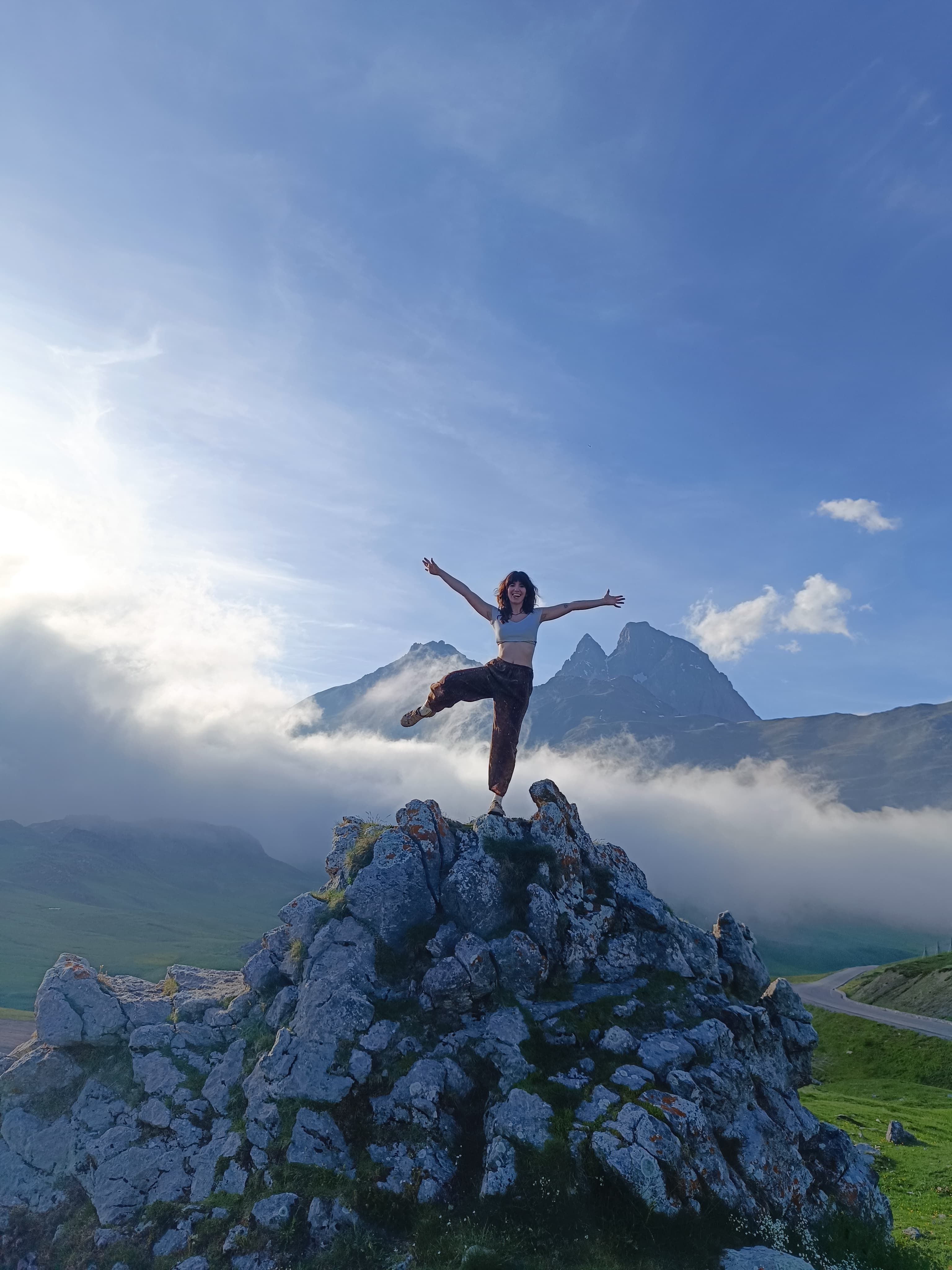 A Woman Standing on a Rock · Free Stock Photo