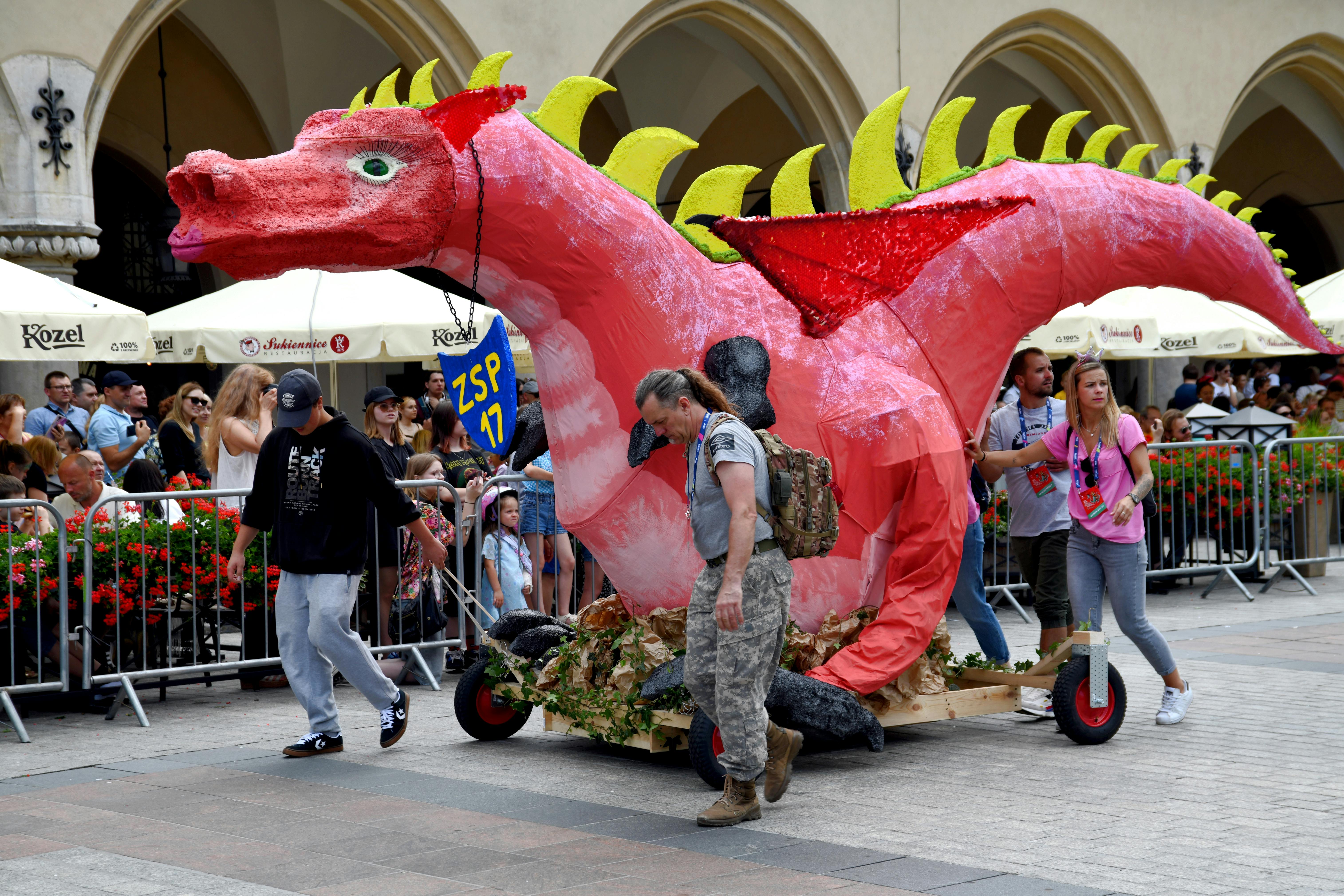 People Towing Dragon Statue in Parade · Free Stock Photo