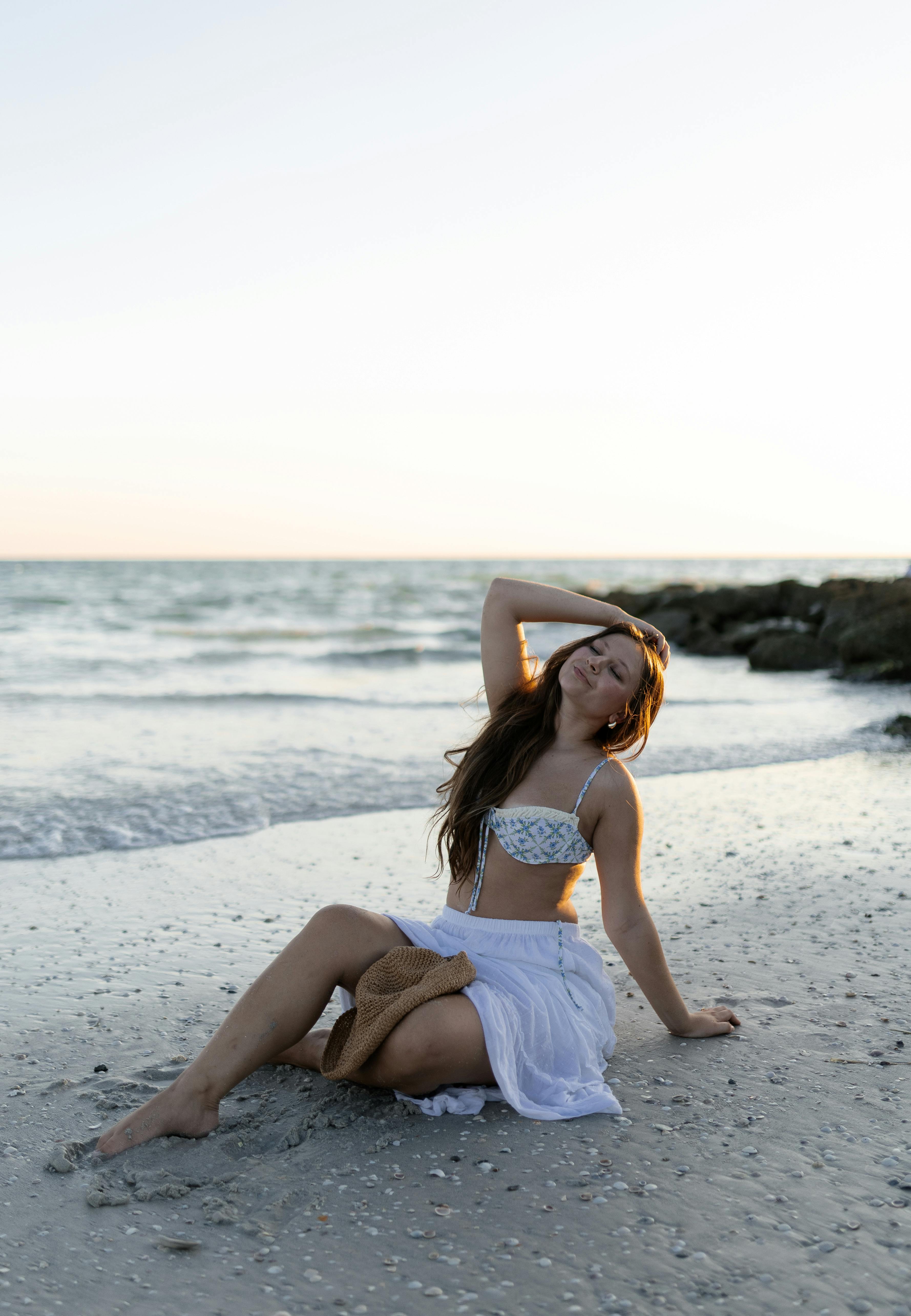 A Woman Posing on the Beach · Free Stock Photo
