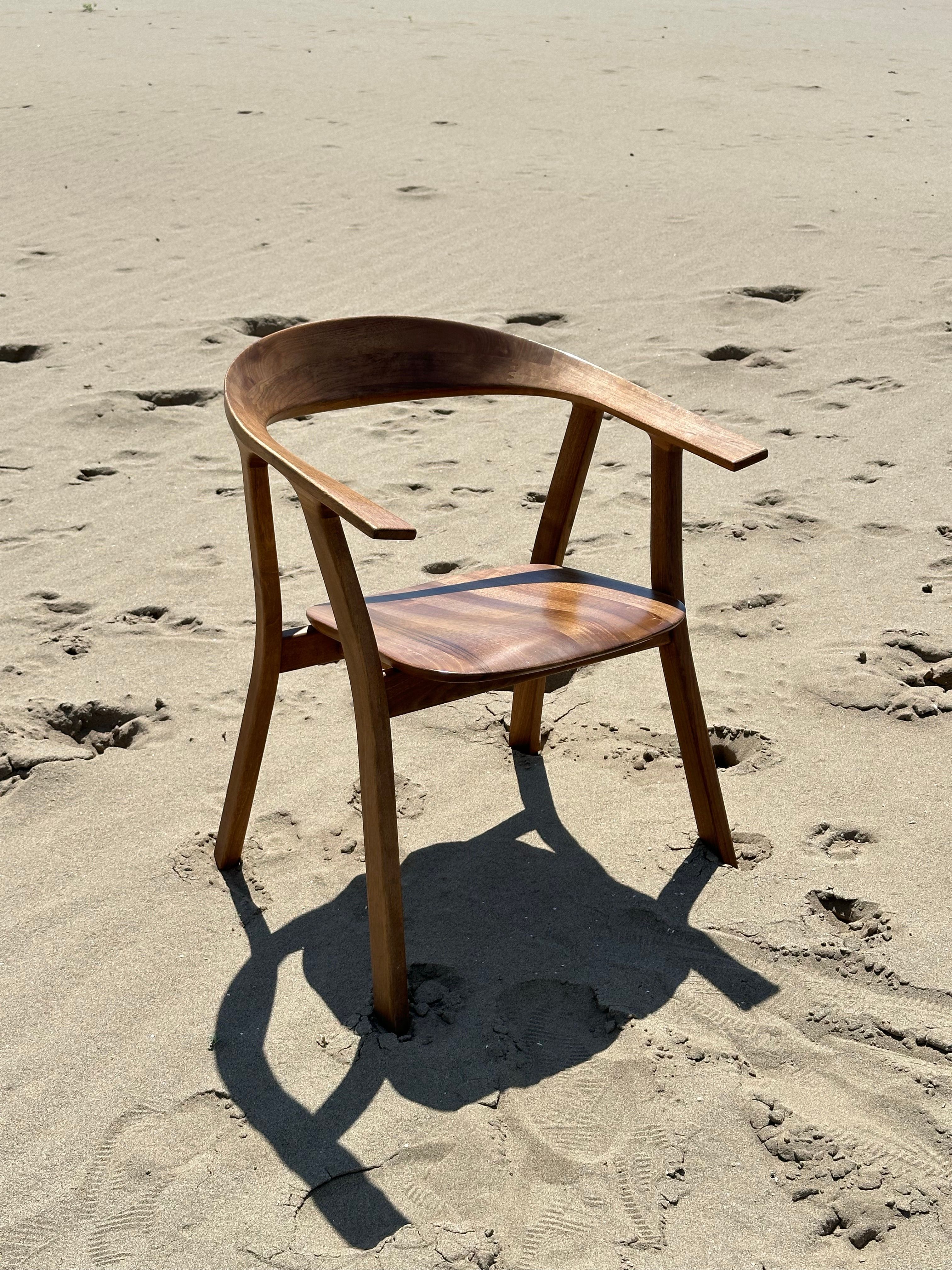 Wooden Chair Casting Shadow on Sand · Free Stock Photo