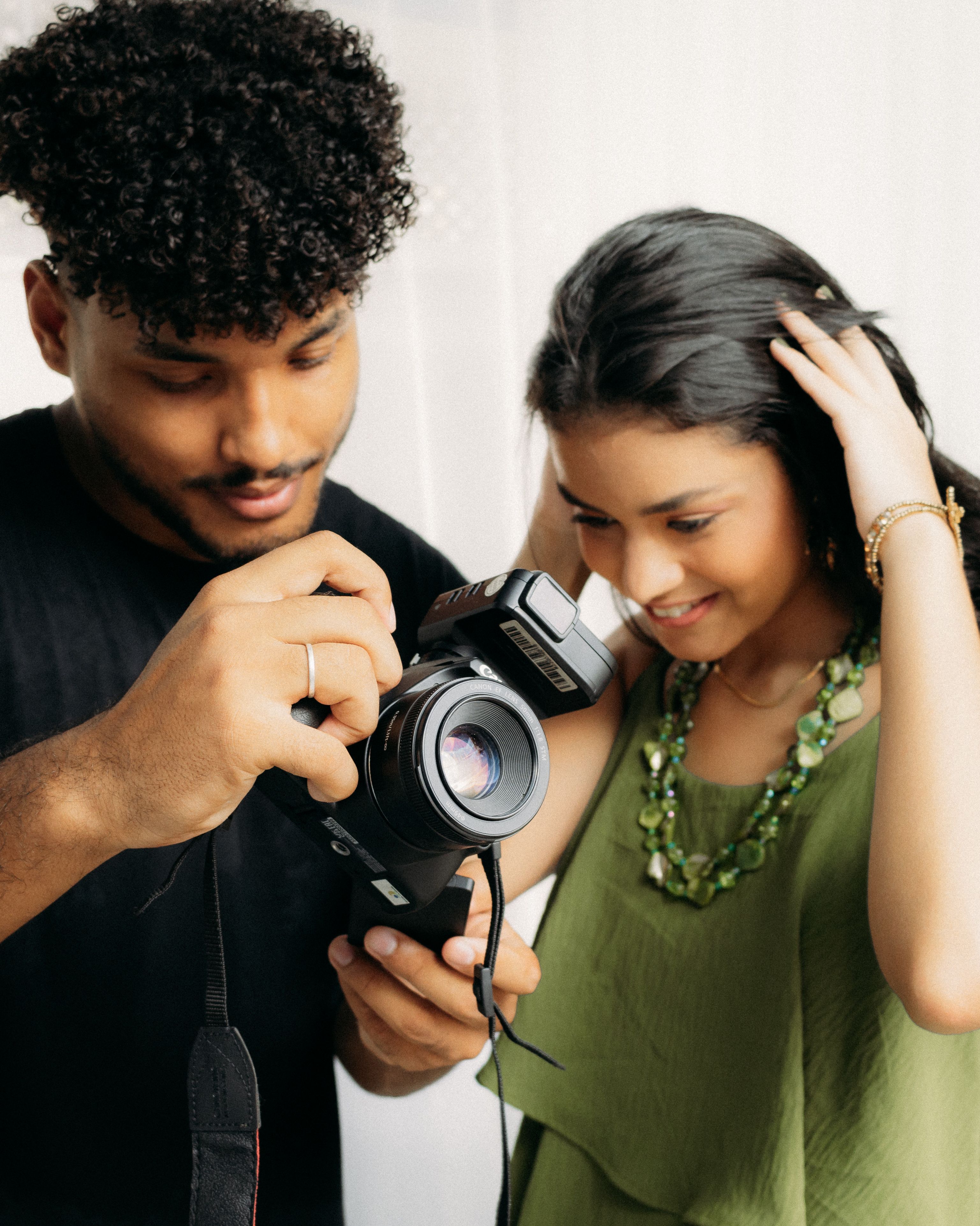 Photographer Showing Woman Photos on Camera · Free Stock Photo