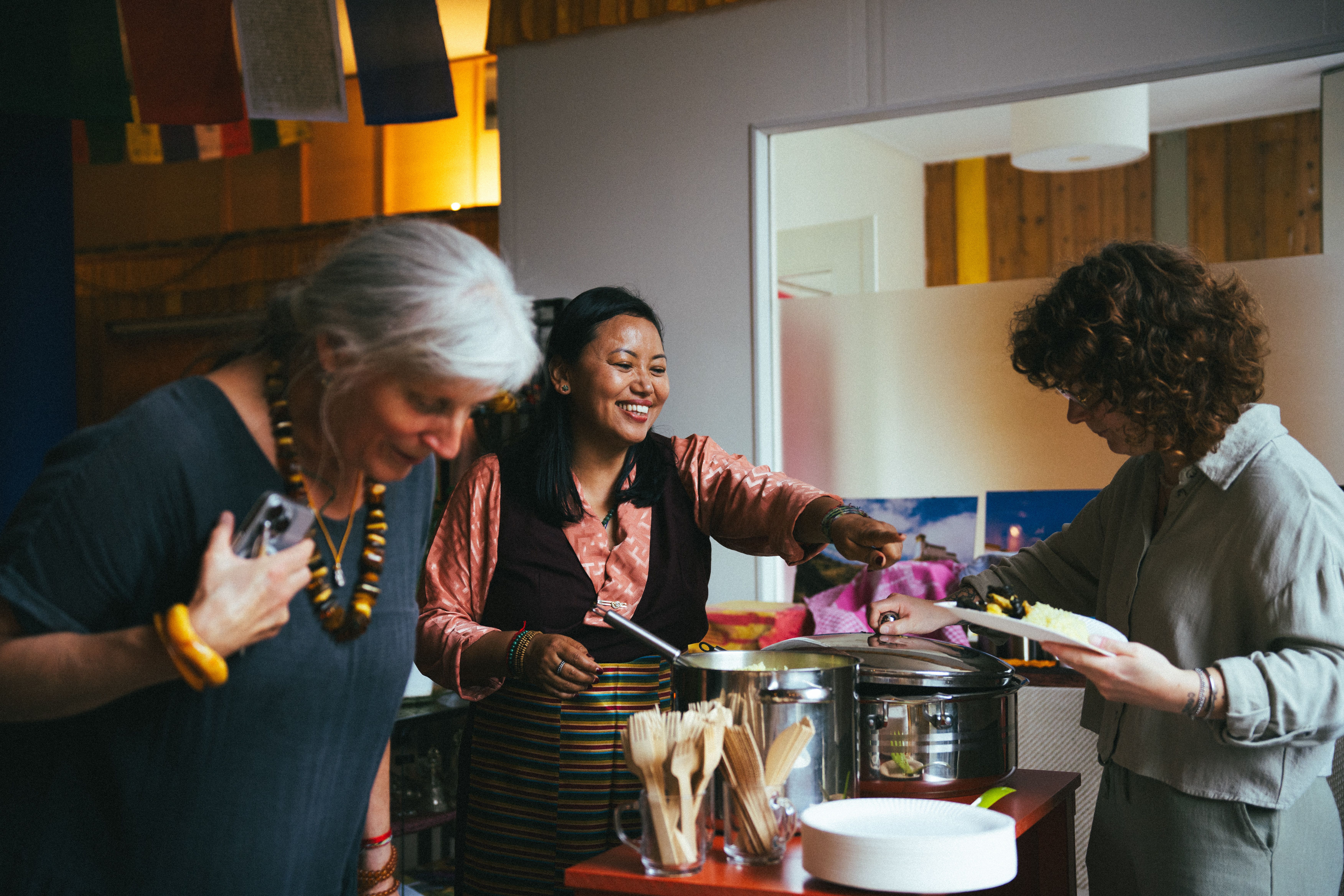 Women Putting Food on the Plates · Free Stock Photo