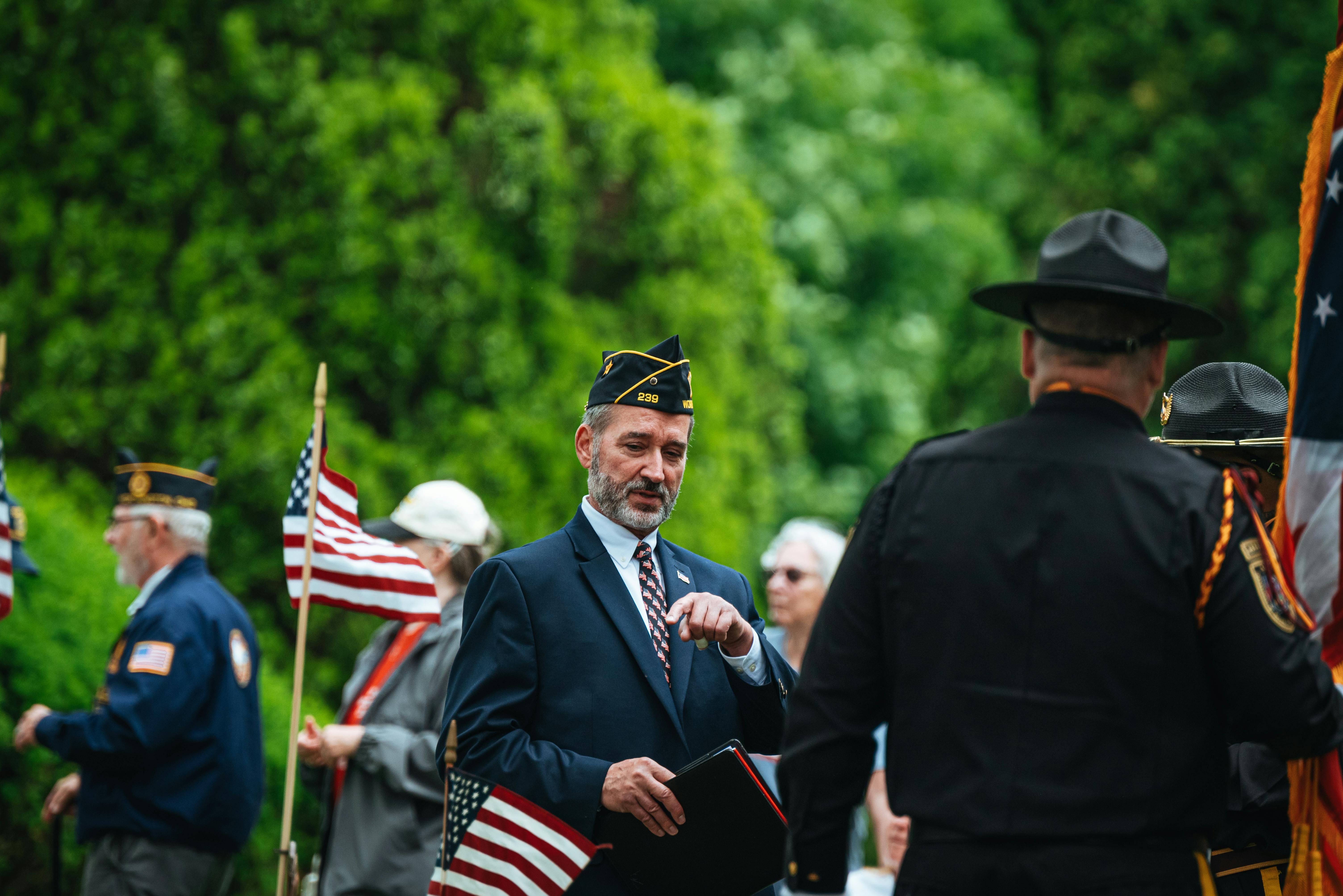 Men in Suit and Uniforms and with Flags in Ceremony · Free Stock Photo