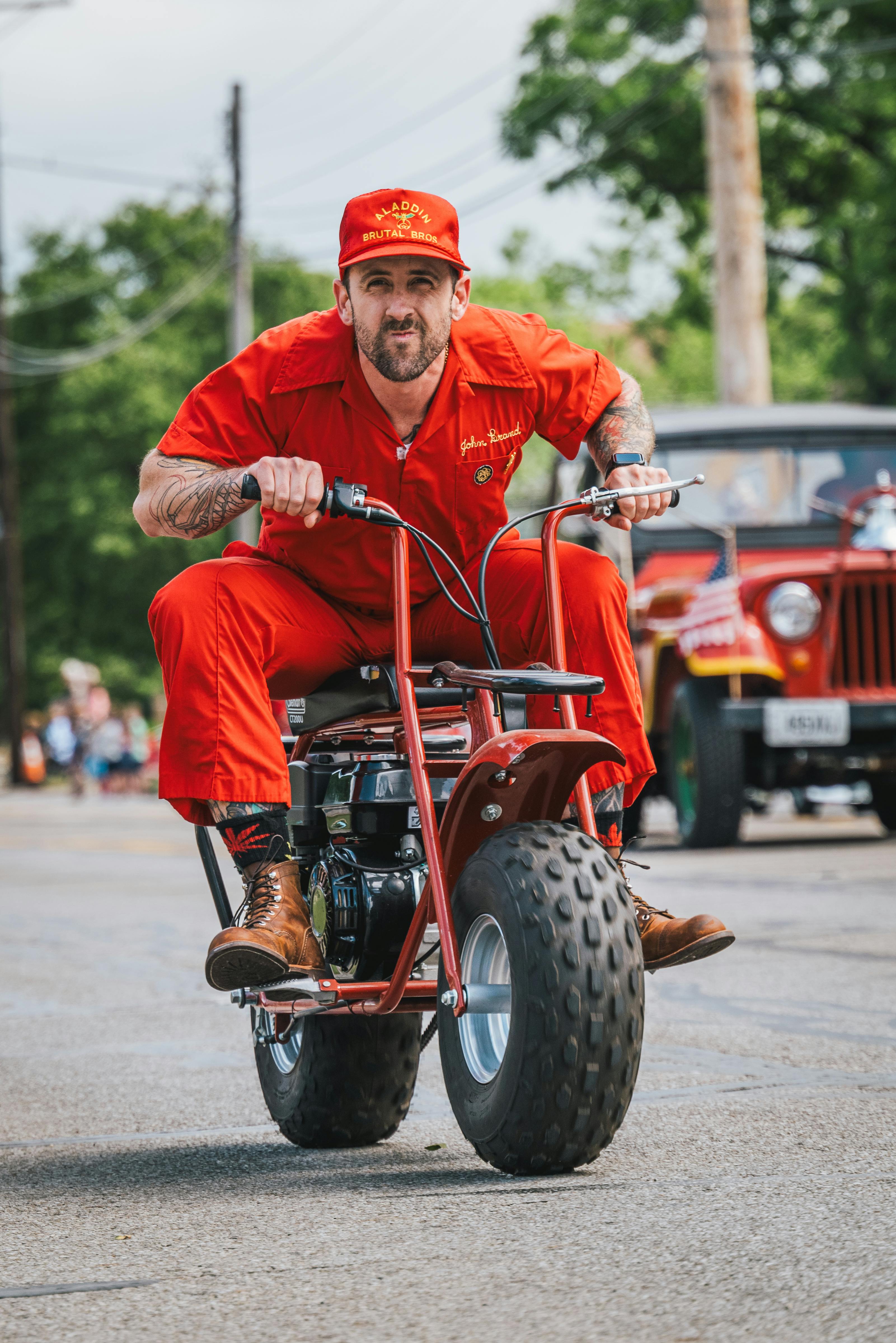 Man Riding Toy Motorbike in Festival · Free Stock Photo