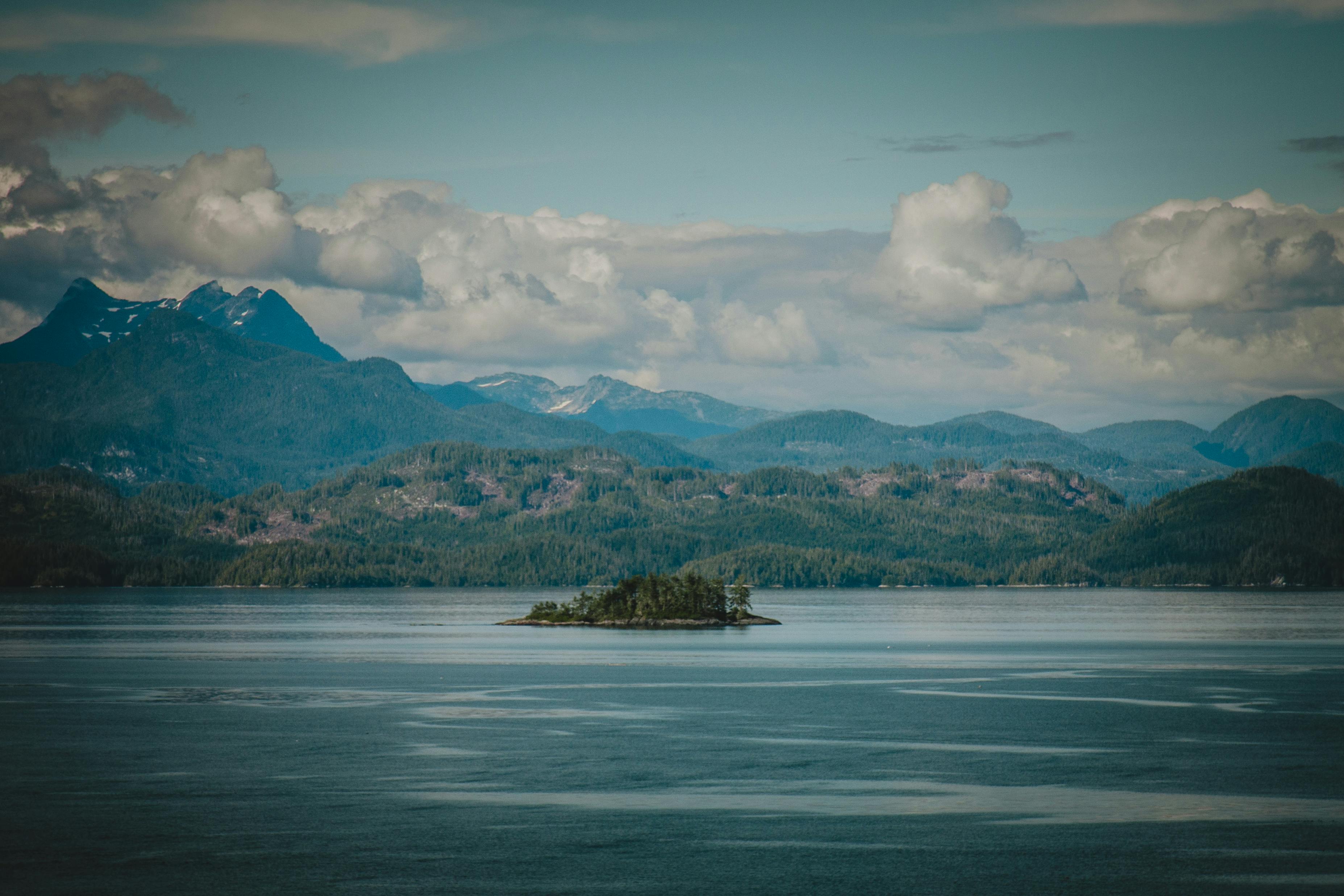 Isolated Alaskan Island with Mountain Backdrop · Free Stock Photo