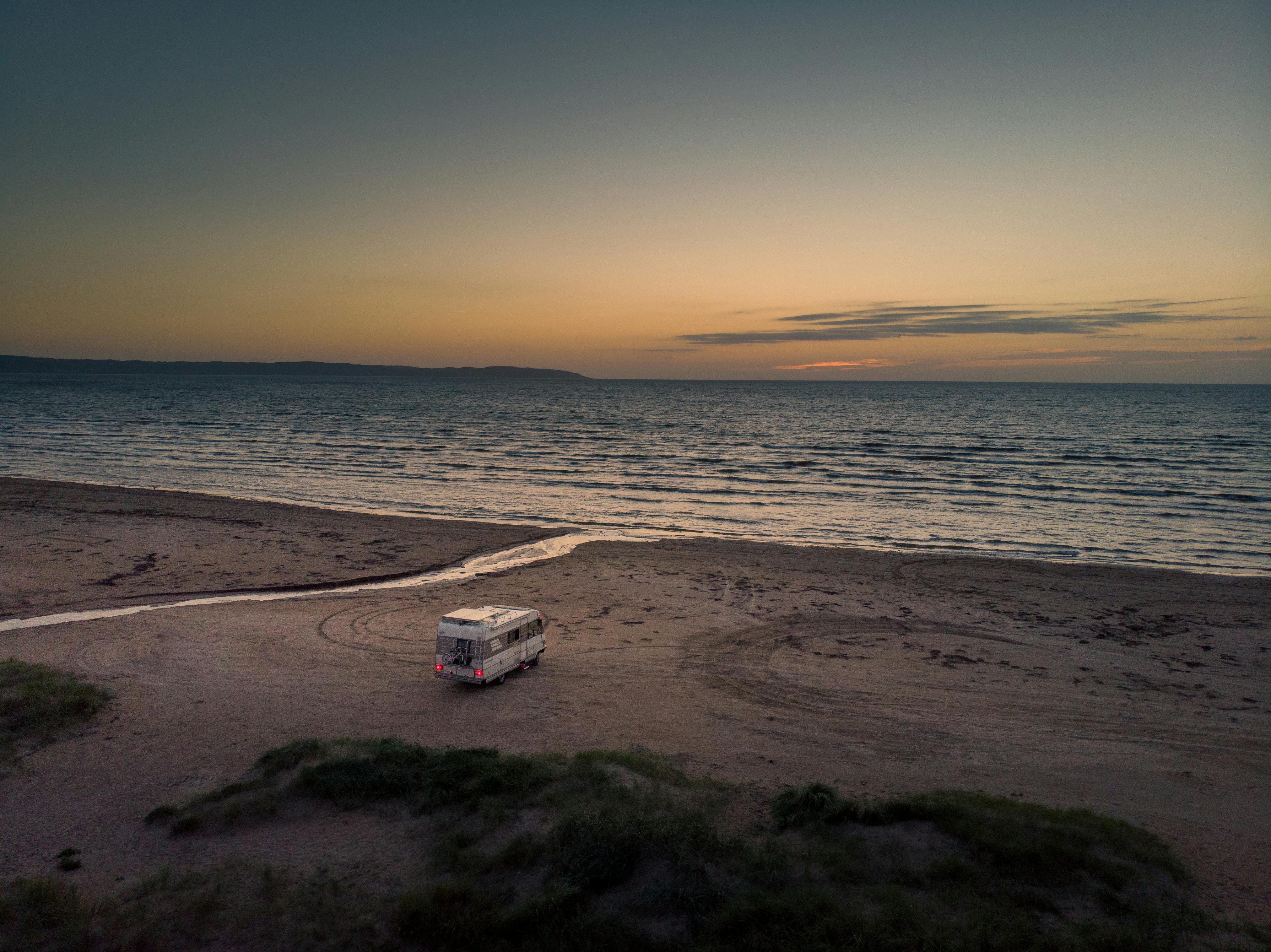 RV on Beach at Sunset · Free Stock Photo
