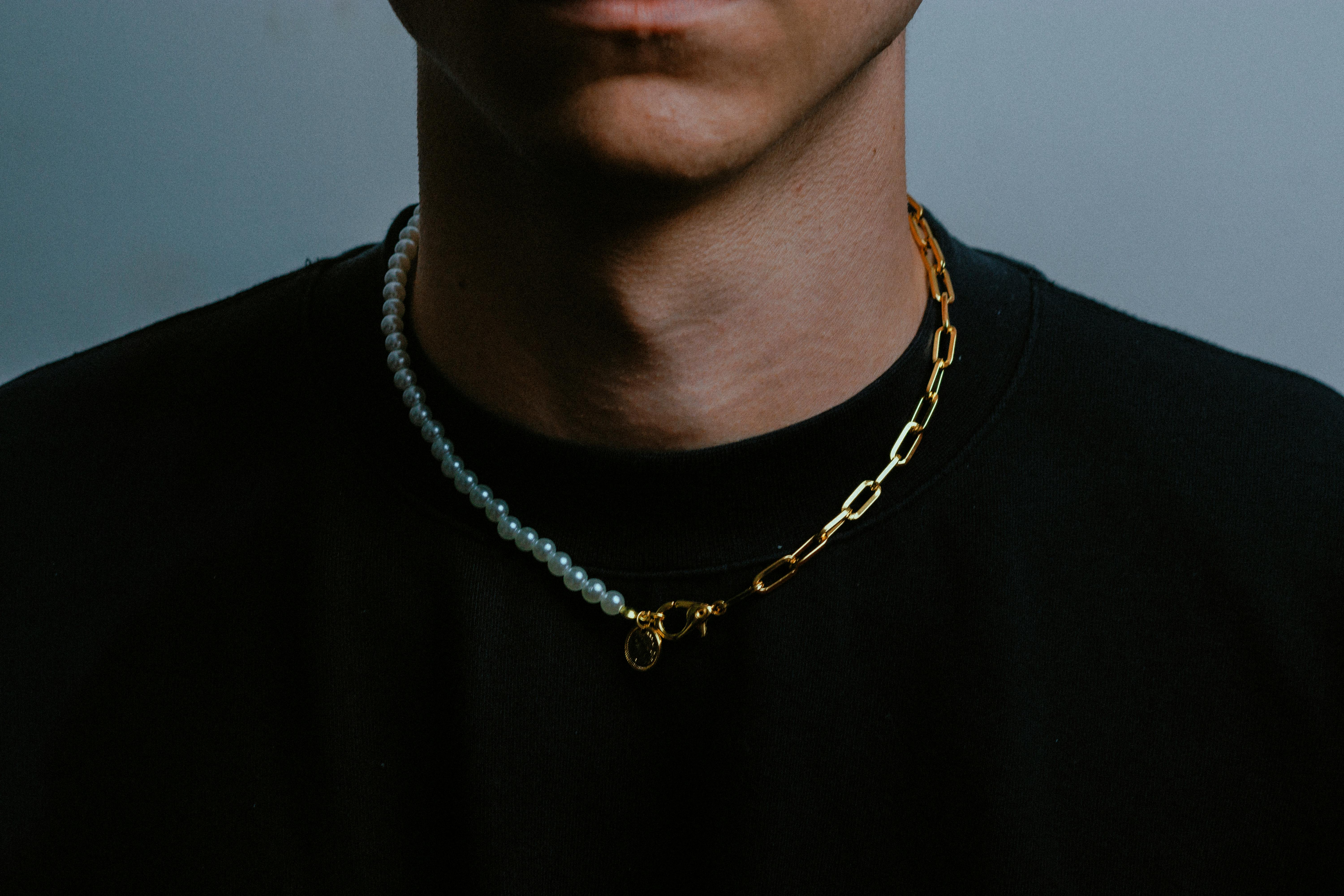 Person Wearing a Gold Chain Necklace · Free Stock Photo