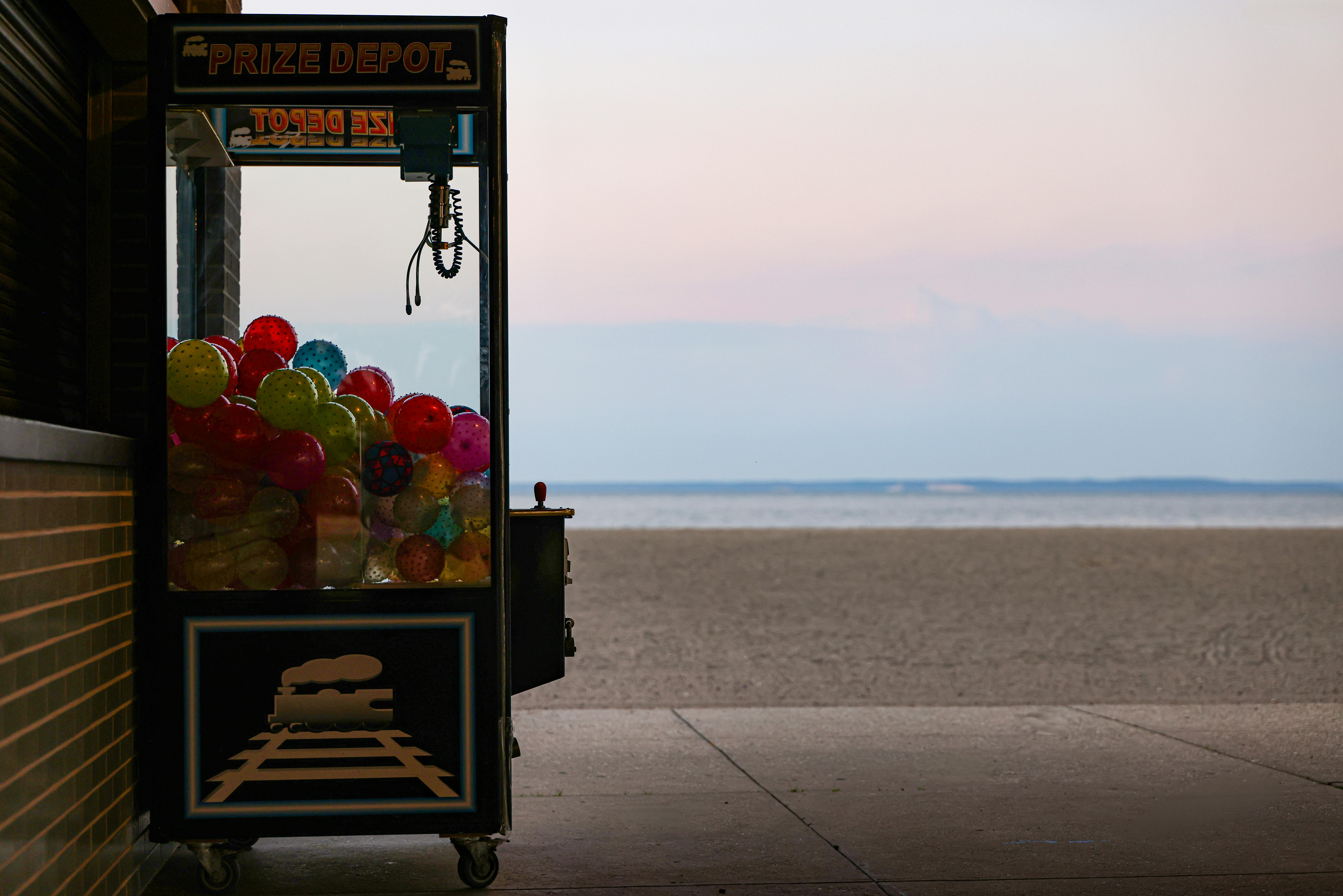 Claw Machine with Balls by Beach · Free Stock Photo