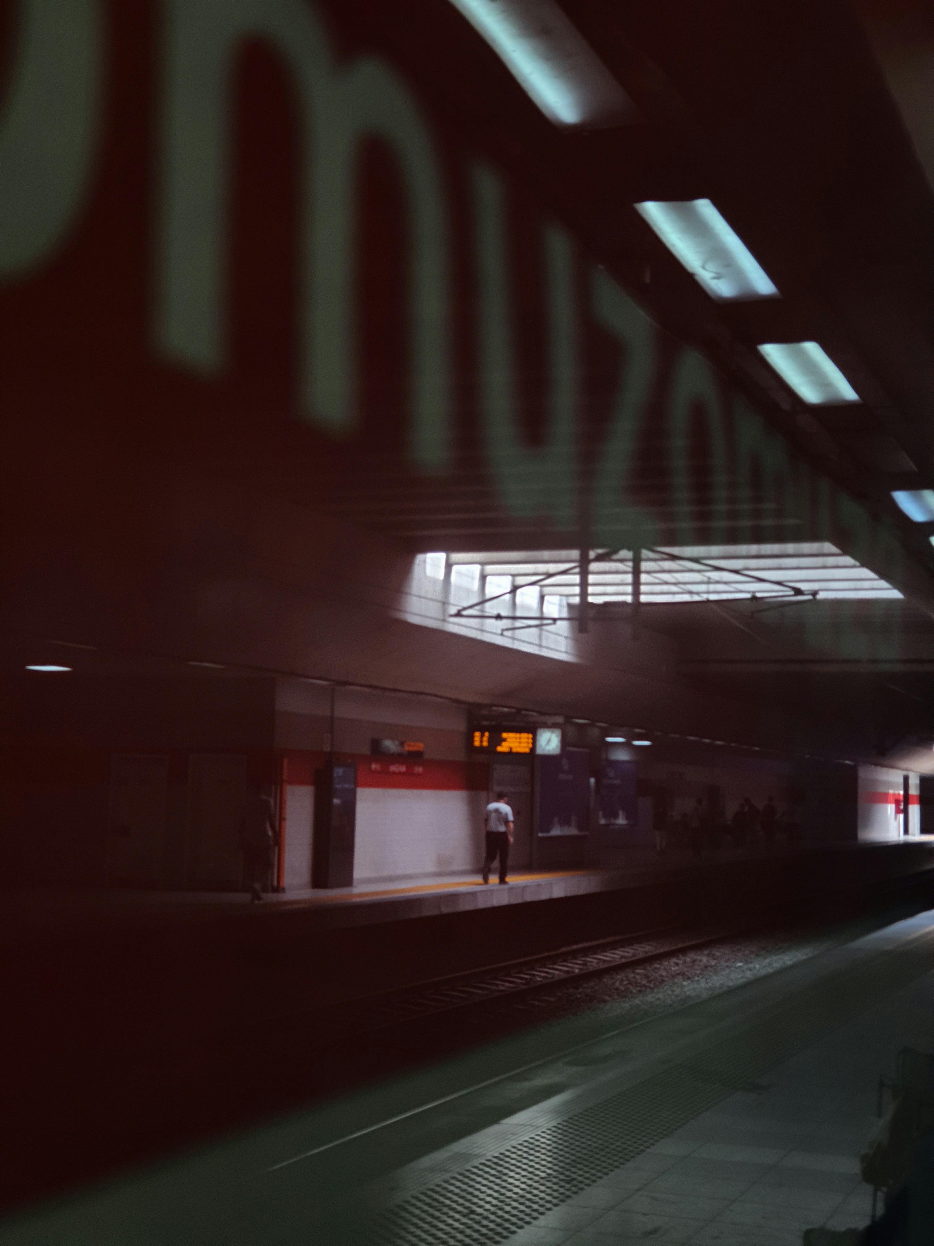 Man on Subway Platform at Night · Free Stock Photo