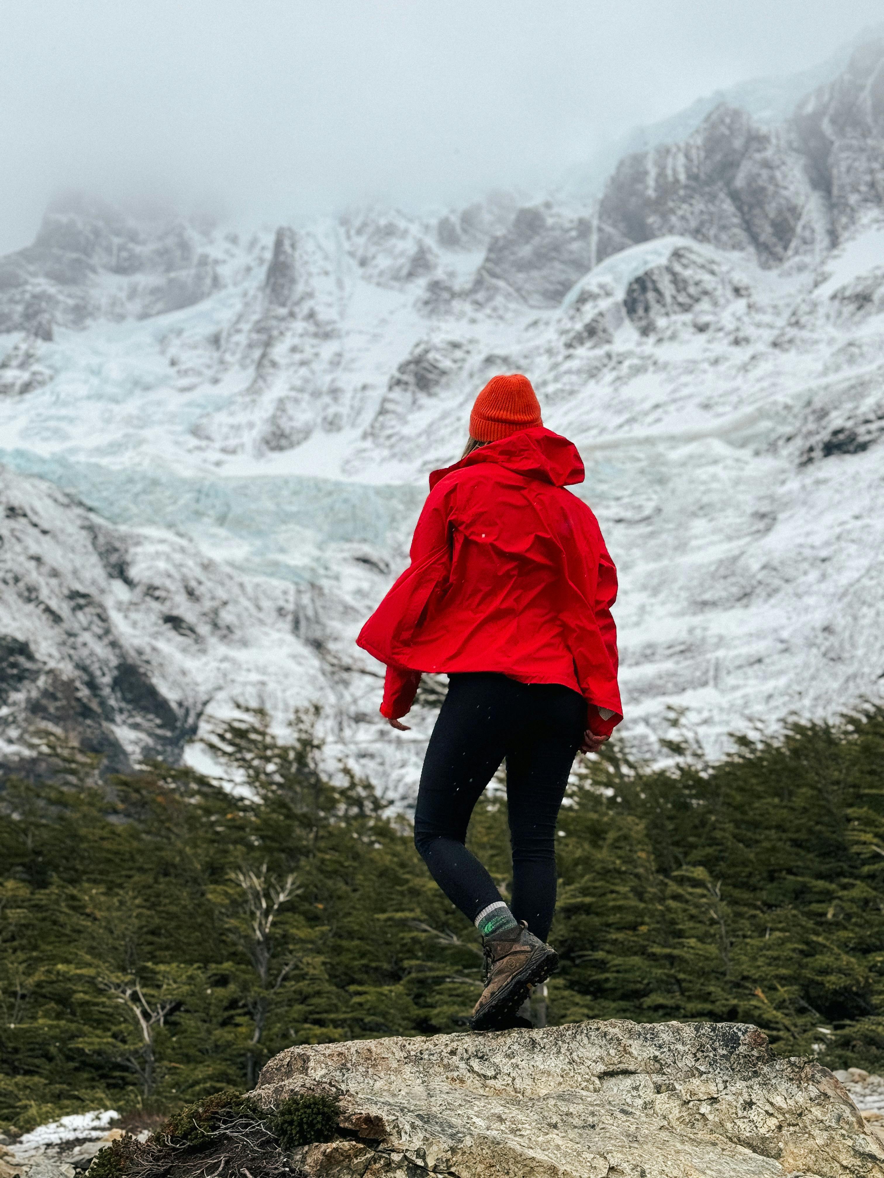 Woman Wearing Red Jacket in a Mountain Valley · Free Stock Photo