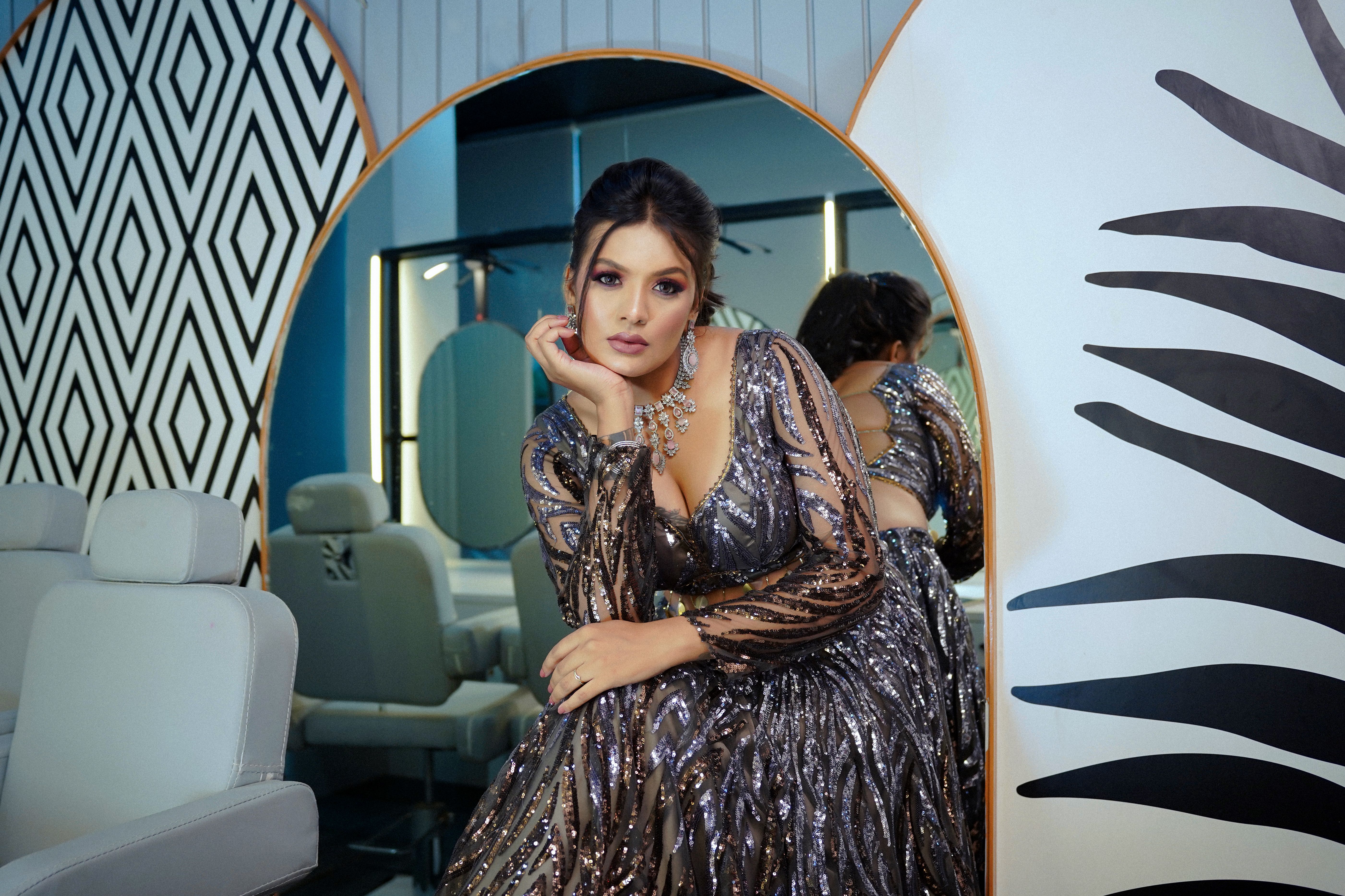 Woman in Evening Dress and Luxury Necklace Leaning Elbow on Lap · Free ...