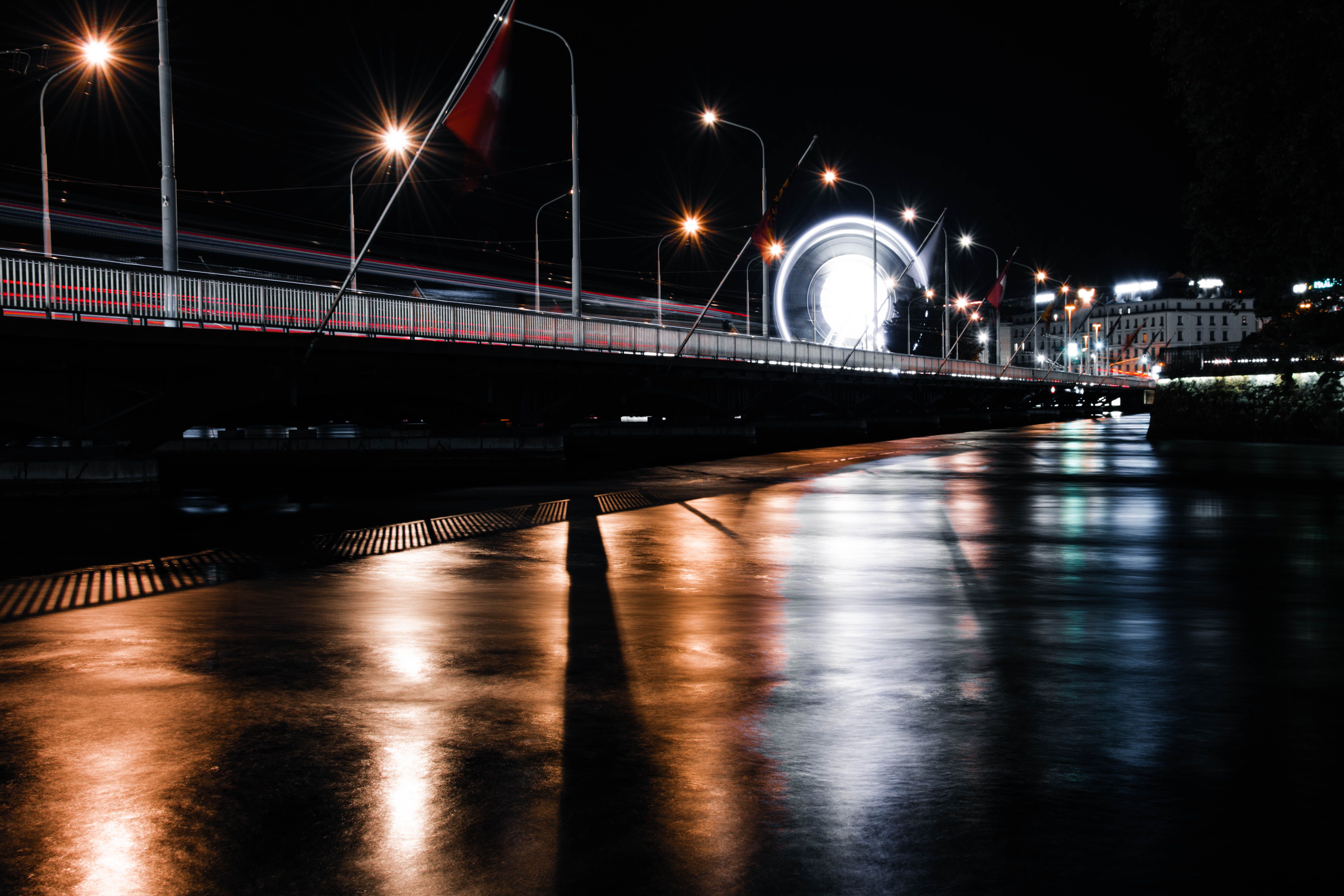 View of Illuminated Bridge and a Ferris Wheel at Night · Free Stock Photo