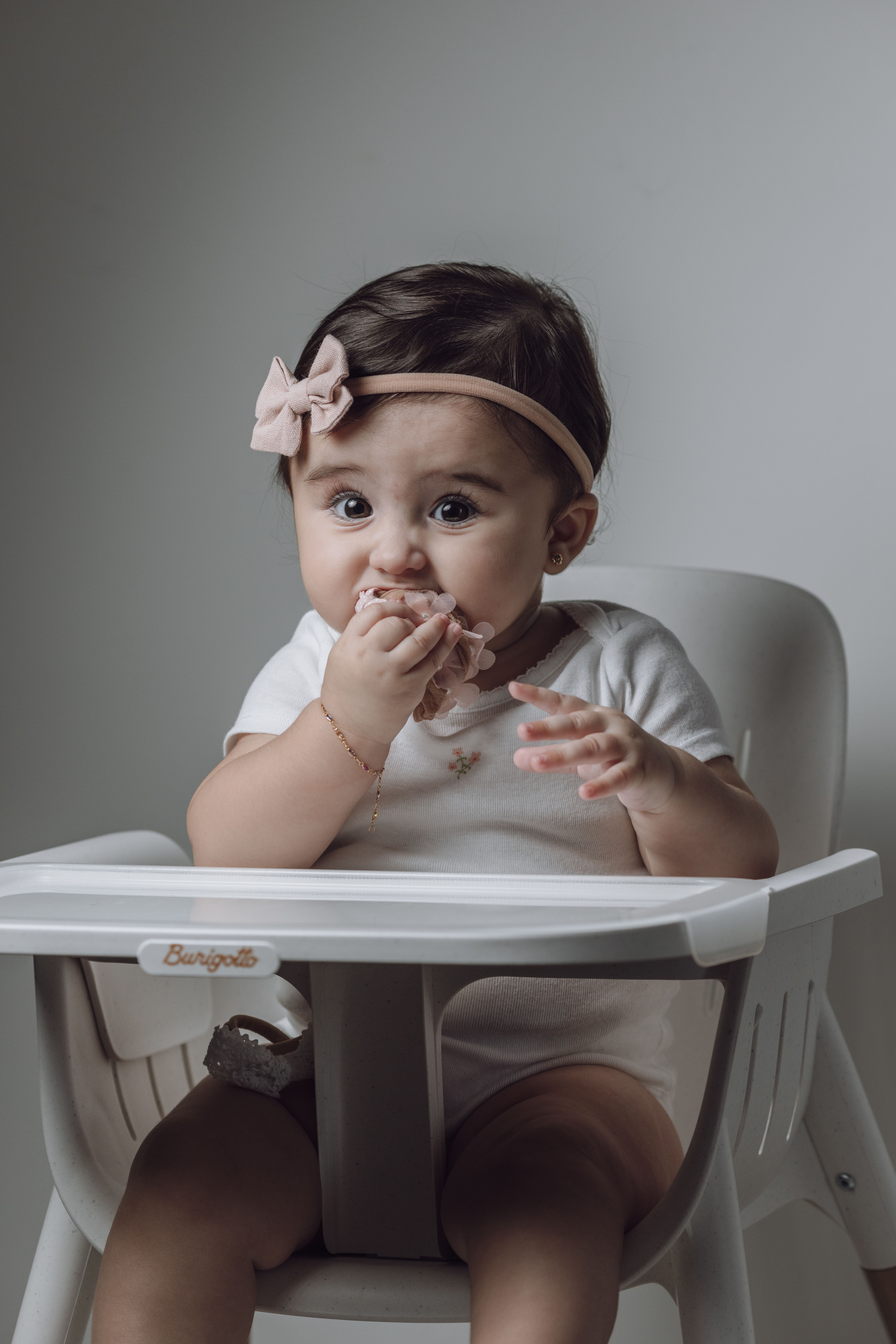 Baby Sitting on Chair with Table and Holding Toy · Free Stock Photo
