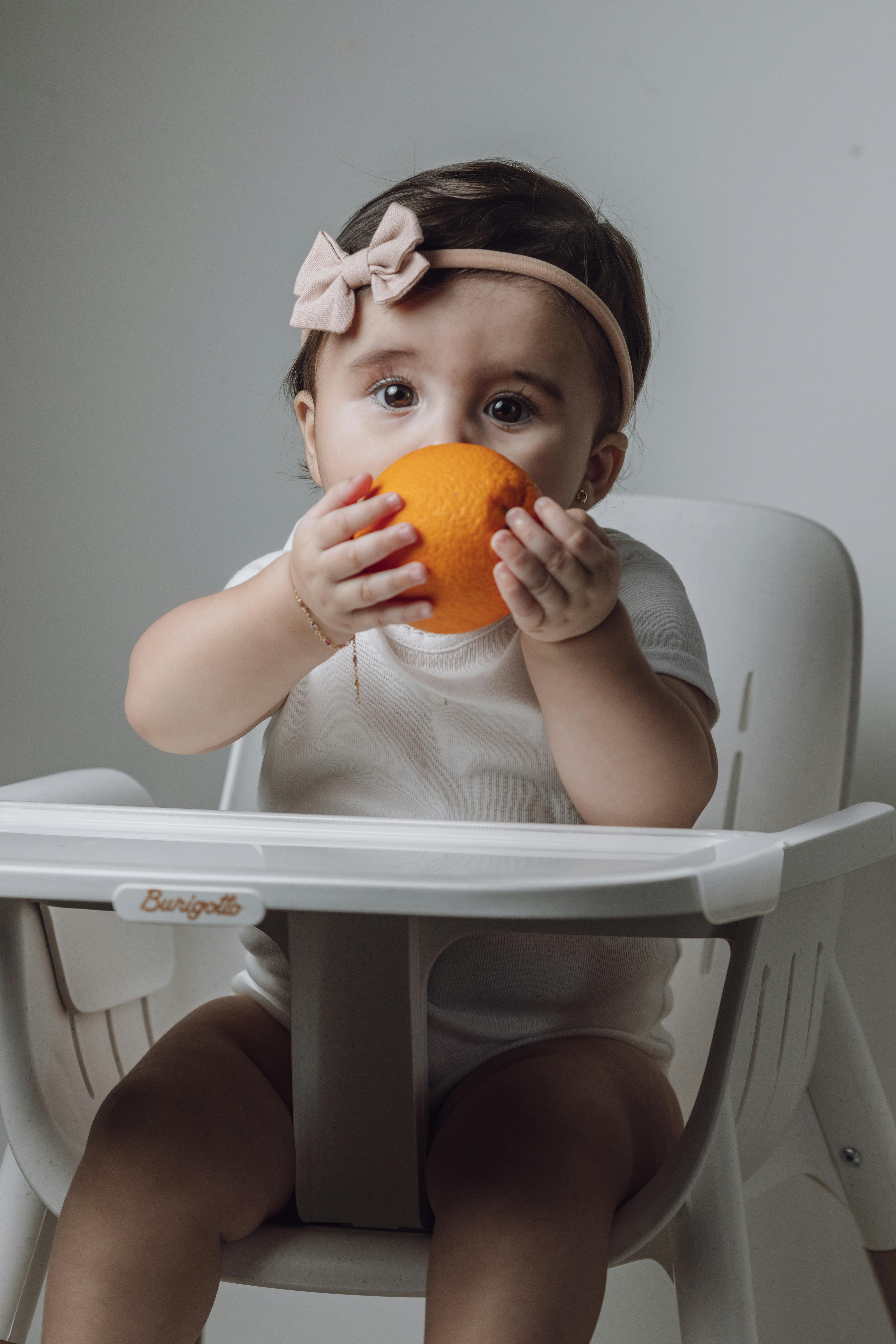Girl Sitting on Baby Chair · Free Stock Photo