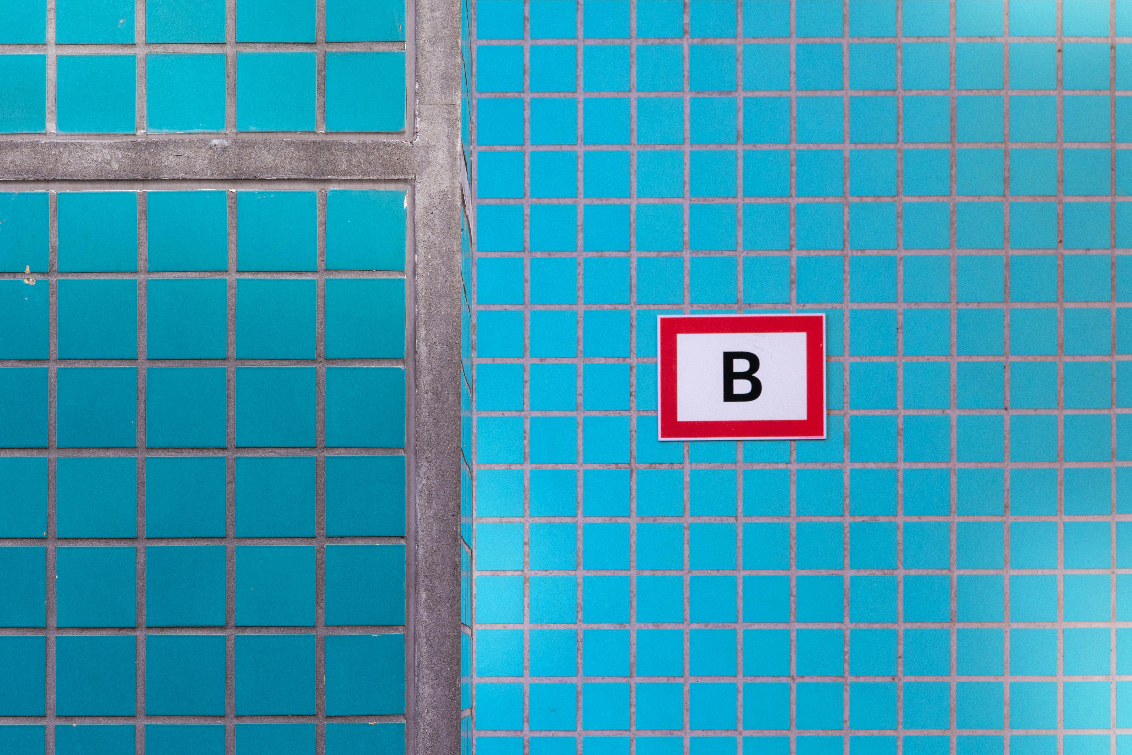 Close-up of Blue Tiles on the Wall and a Sign with a Letter B · Free ...