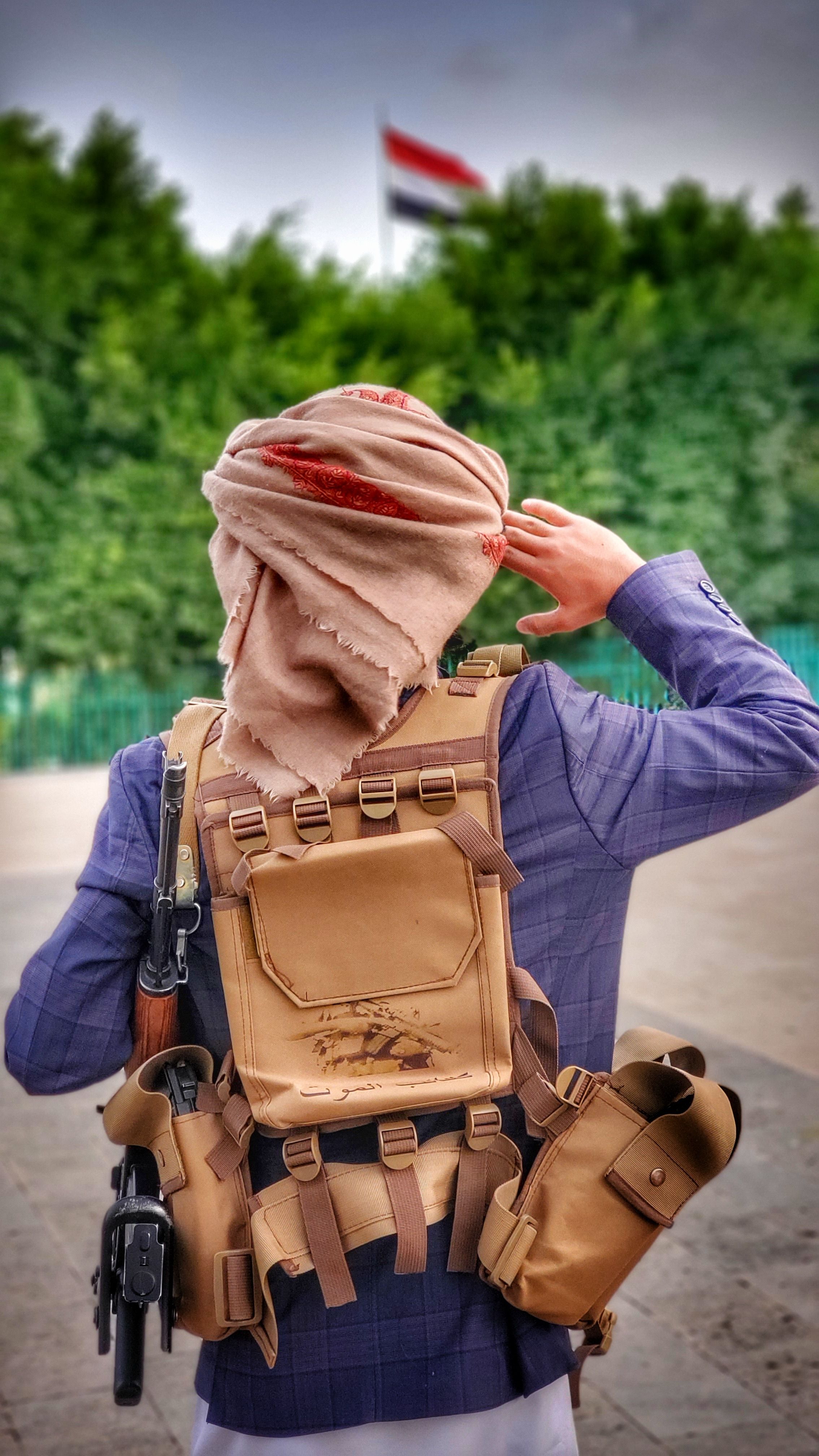 Back View of Man in Turban and with Tactical Vest with Pistol · Free ...