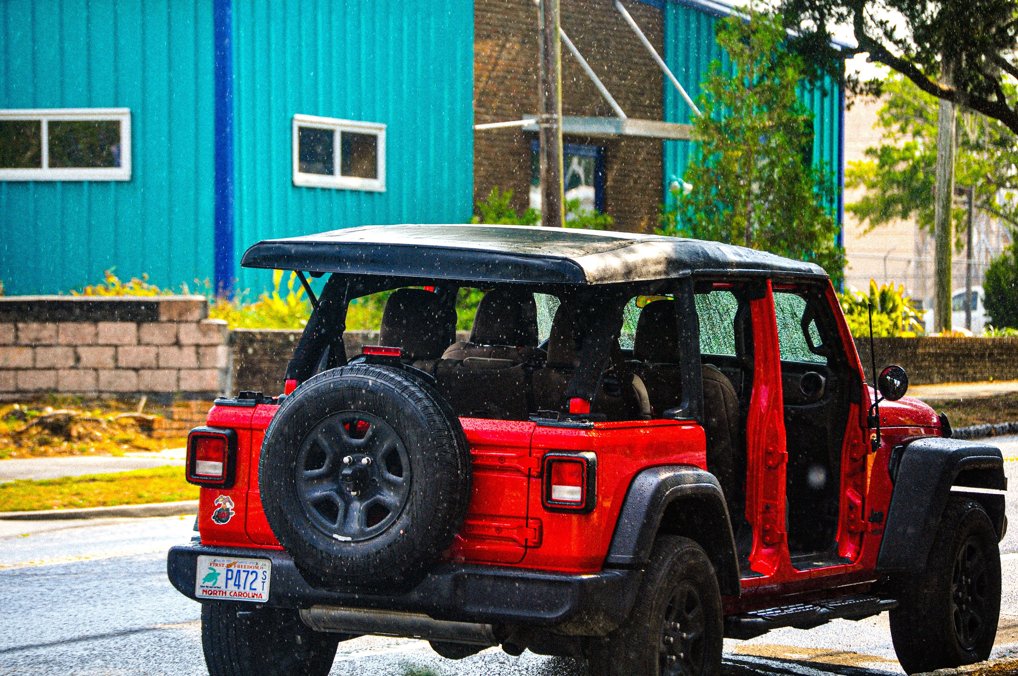 Red Jeep Wrangler in Rain · Free Stock Photo