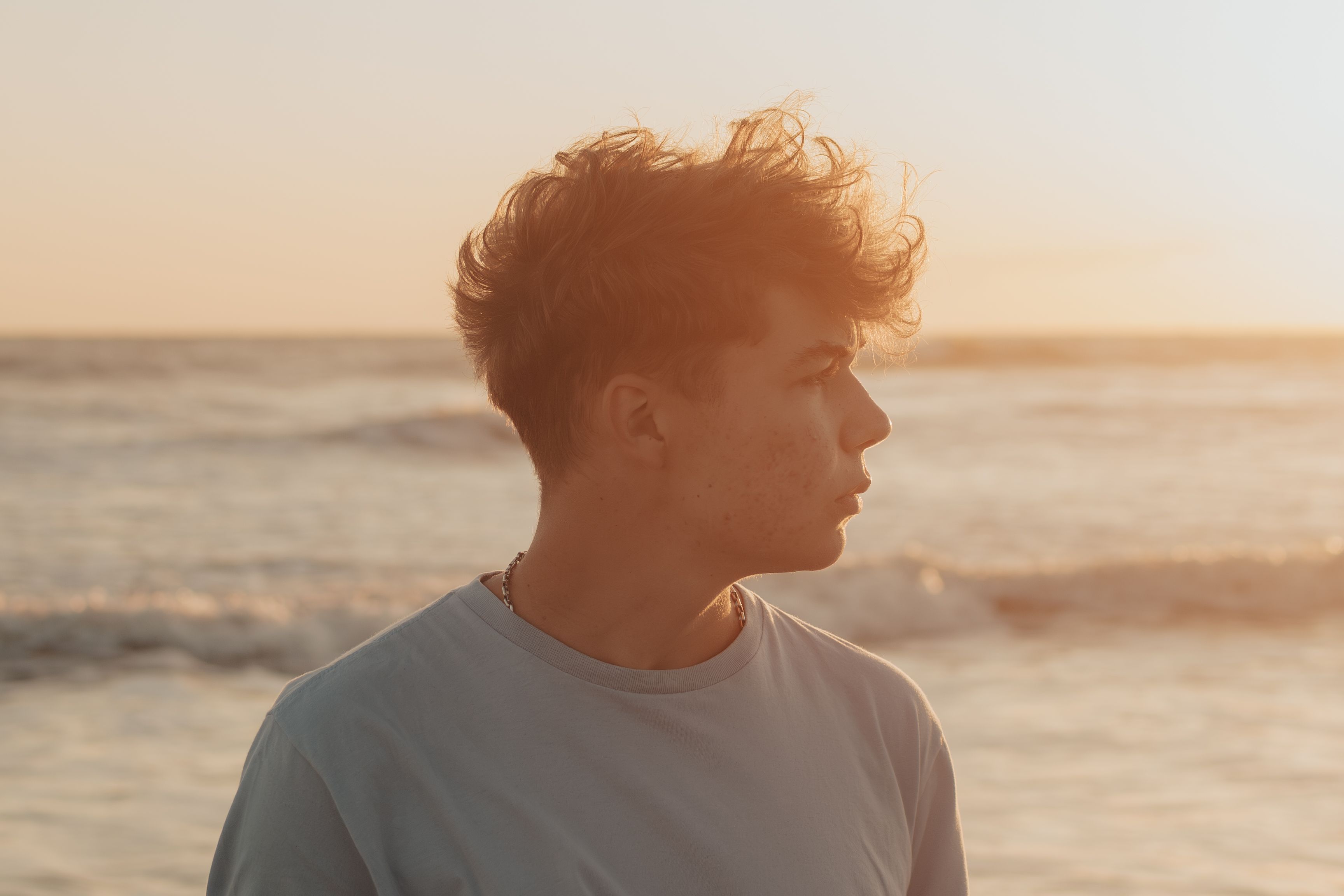 Portrait of Man on Sea Shore at Sunset · Free Stock Photo