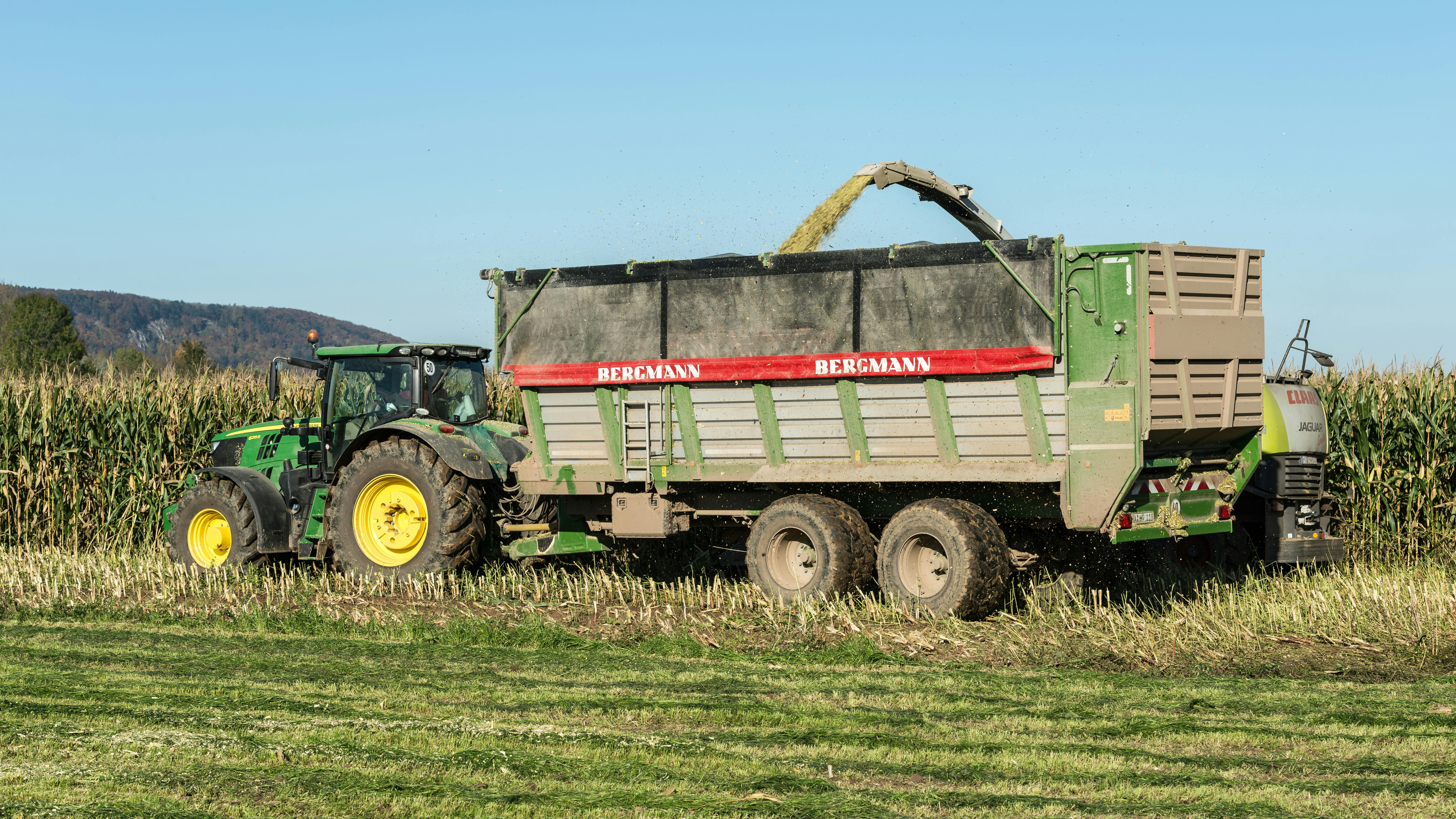 Tractor with Carriage on a Field · Free Stock Photo