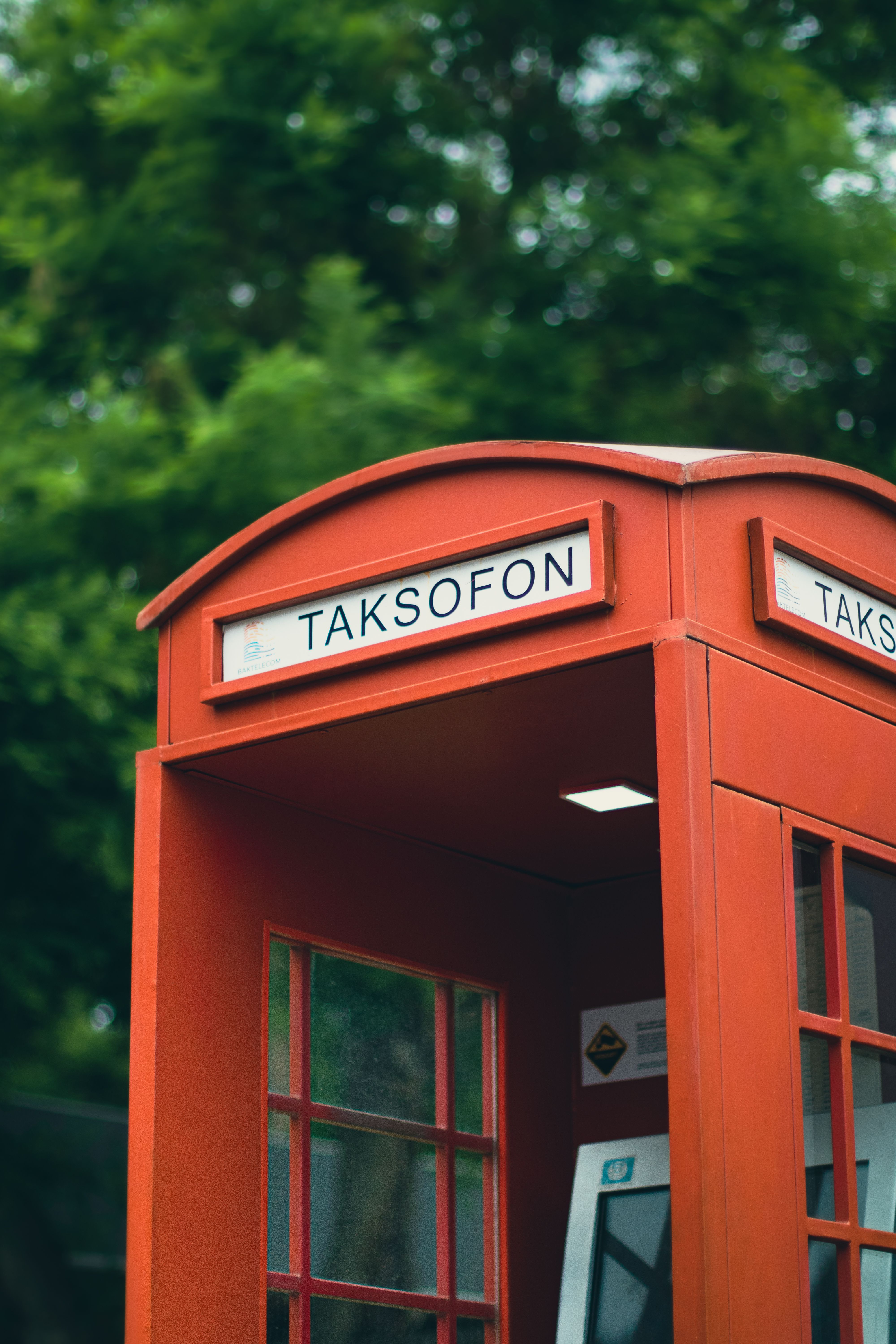 A red telephone booth with the word taketown on it · Free Stock Photo