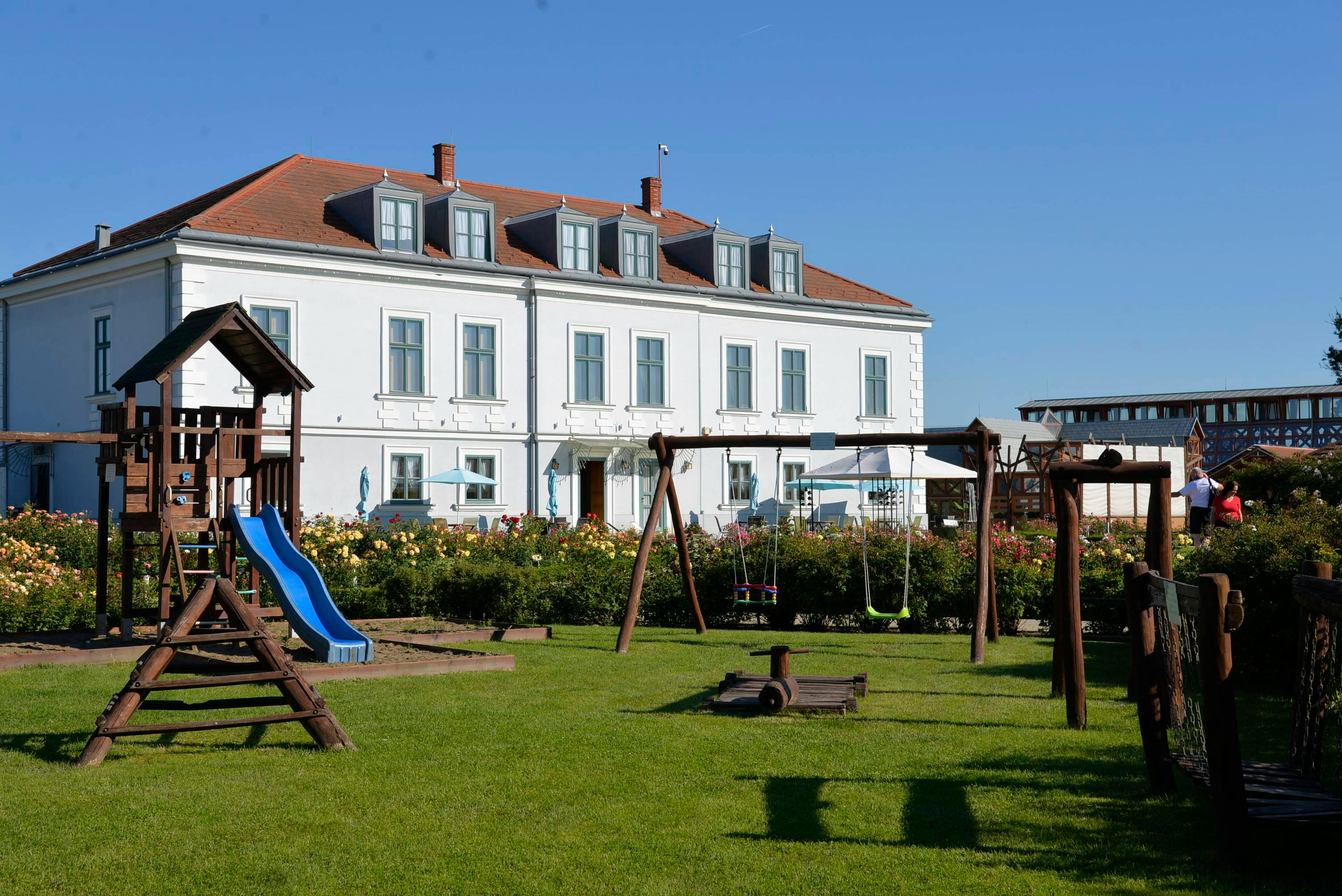Mansion with a Playground on the Yard · Free Stock Photo