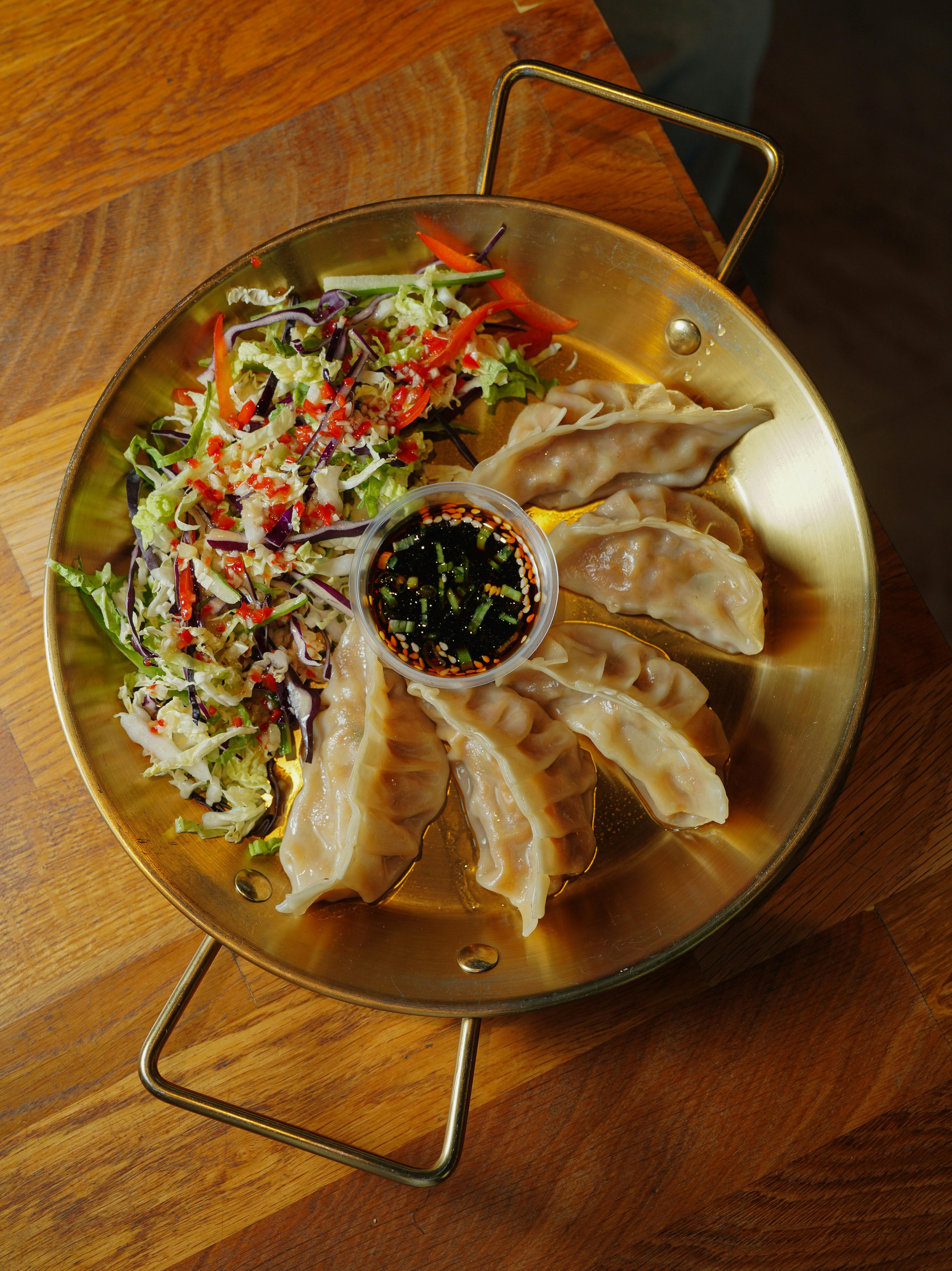 Gyoza Dumplings with Soy Sauce and Vegetables on a Golden Tray · Free ...