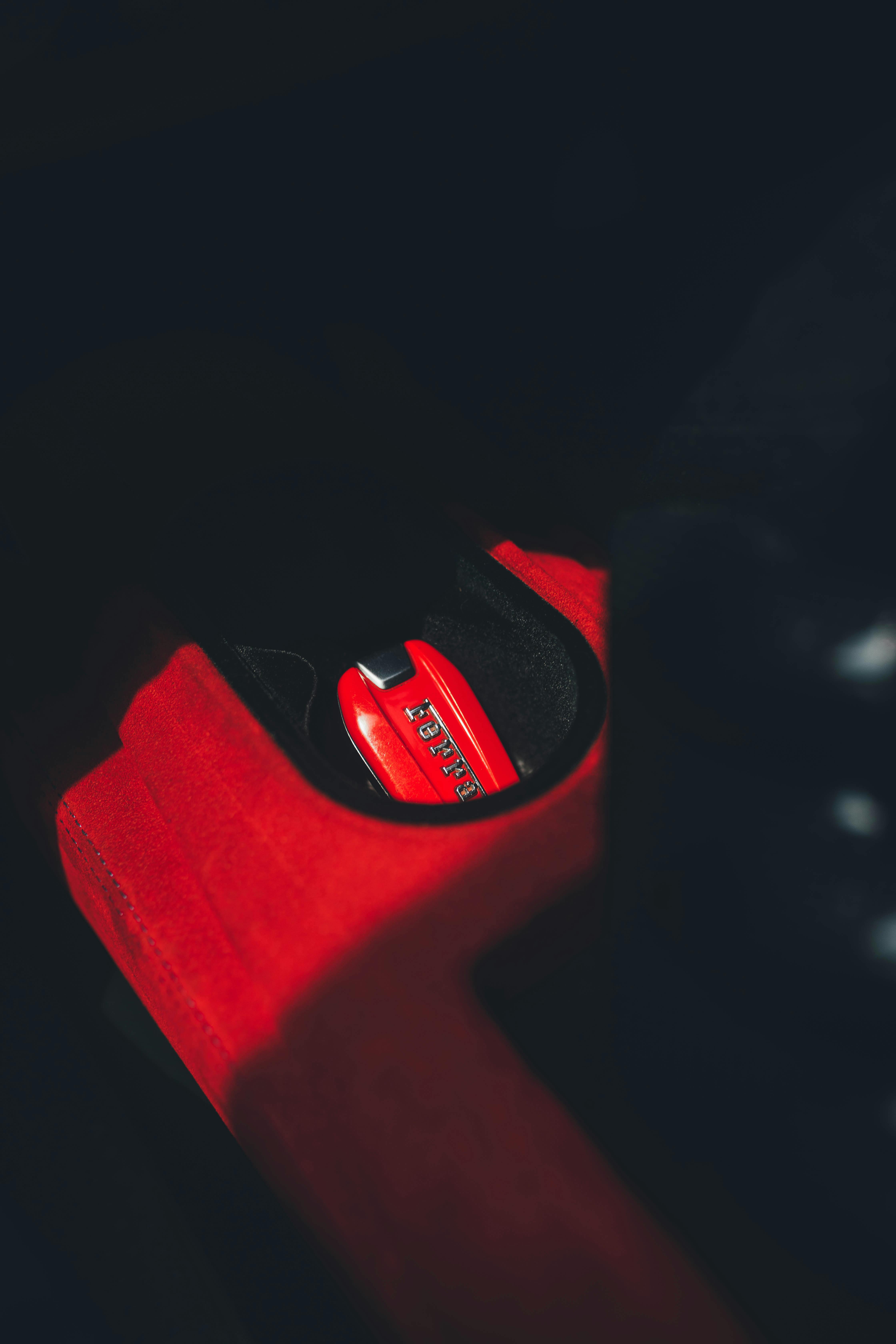 Car Keys Lying in Red Cup Holder · Free Stock Photo