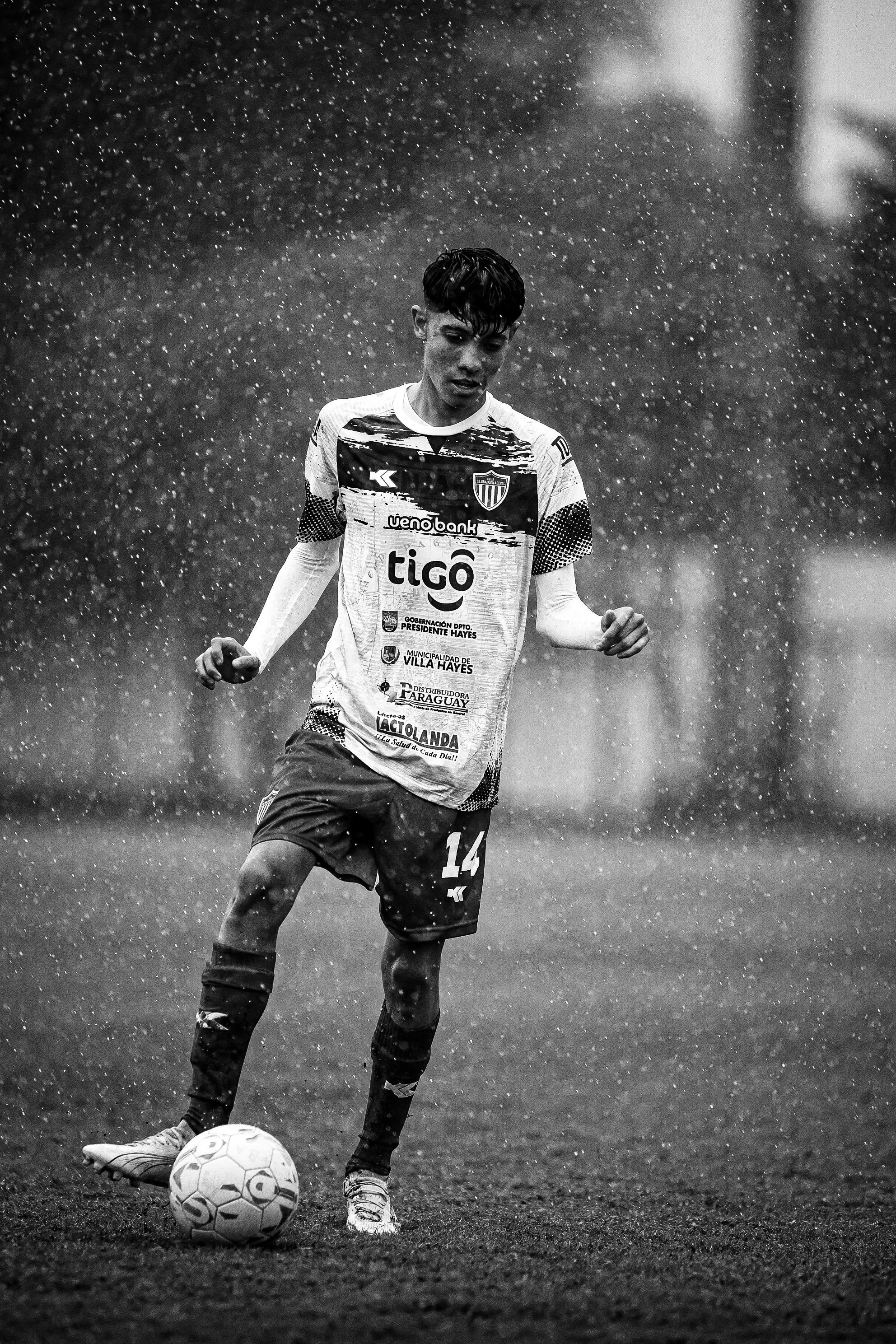 Young Skinny Football Player Playing on Pitch During Rain · Free Stock ...