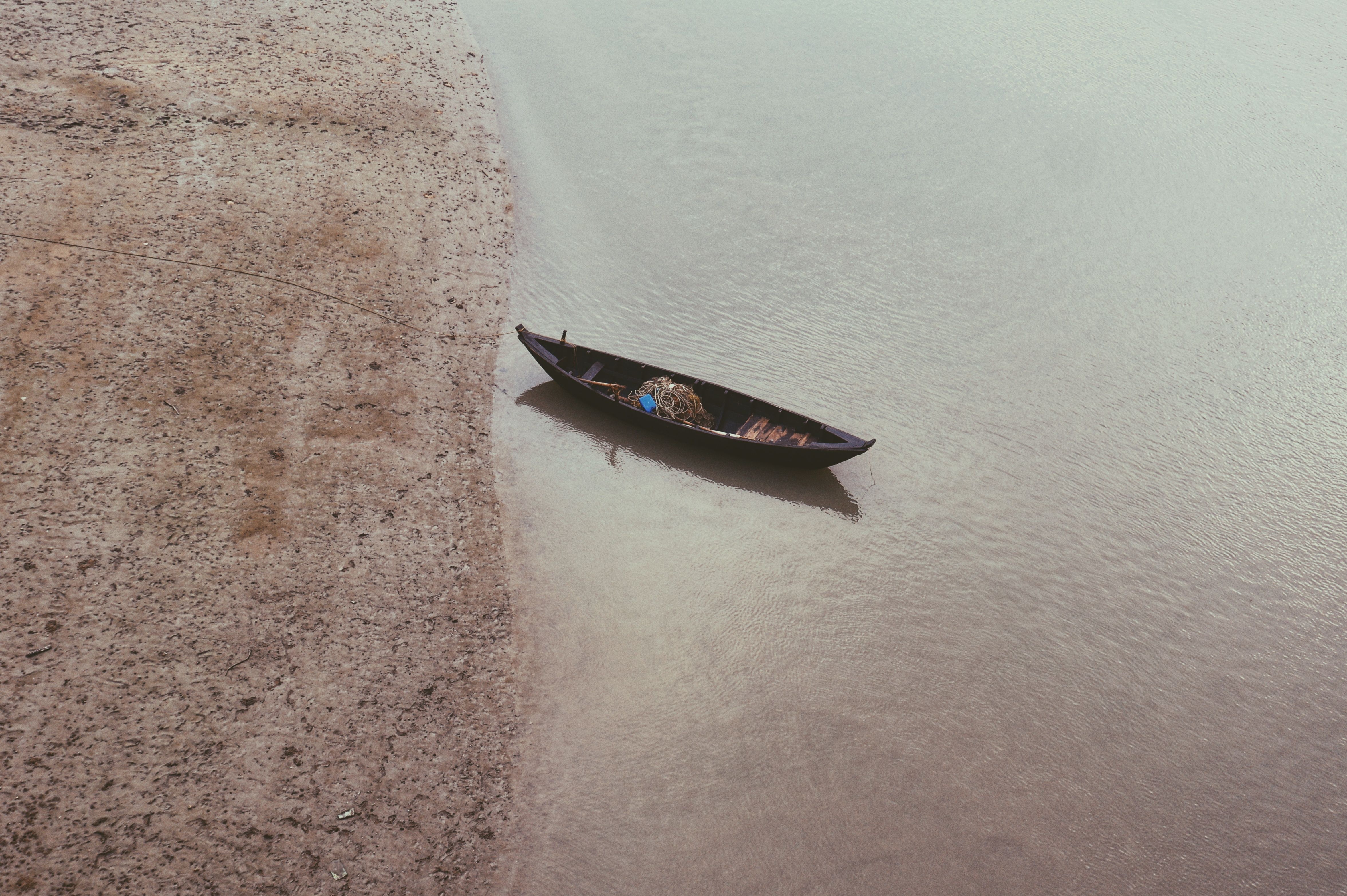 Narrow Wooden Canoe Boat on Beach · Free Stock Photo