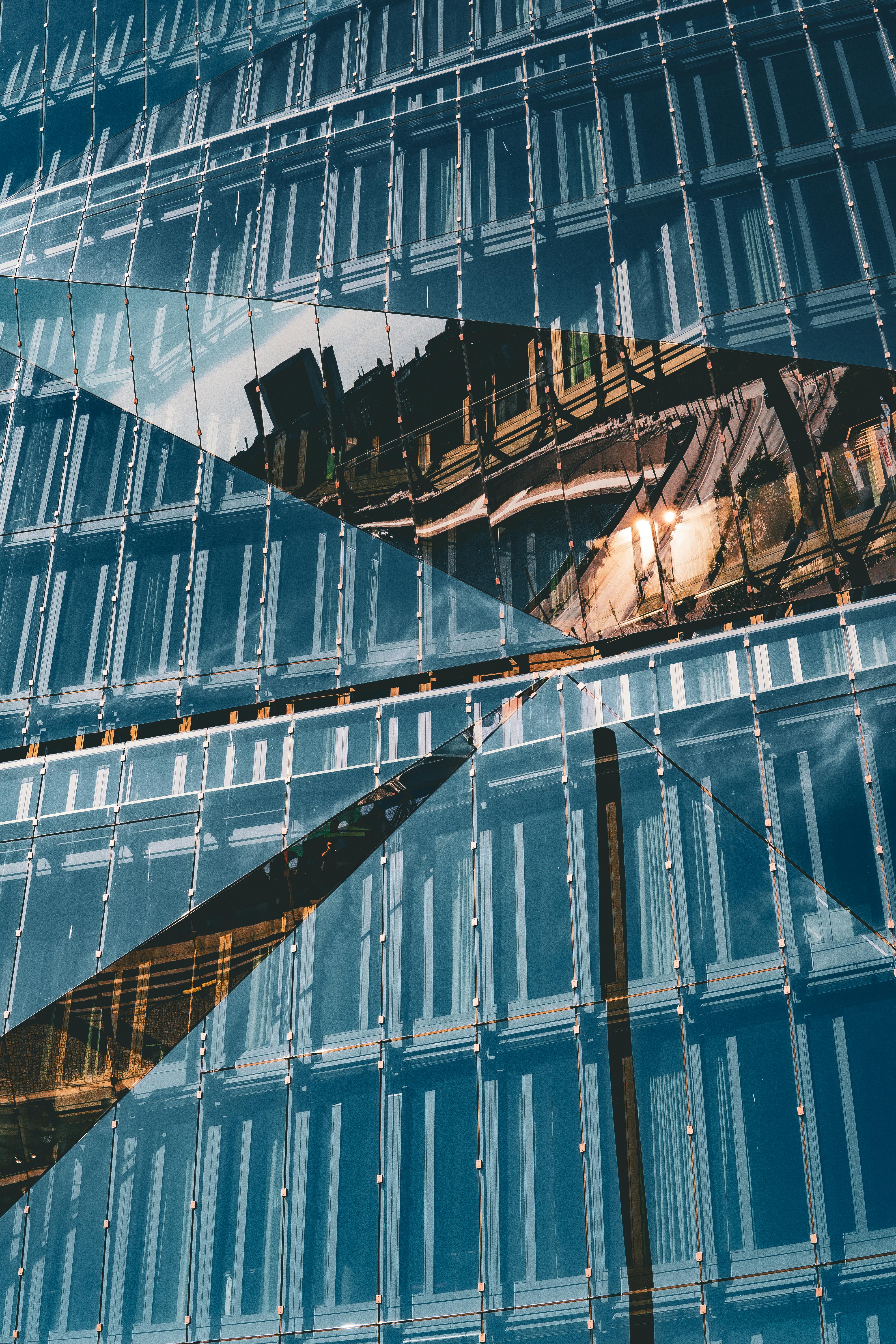 Reflections On A Glass Building · Free Stock Photo