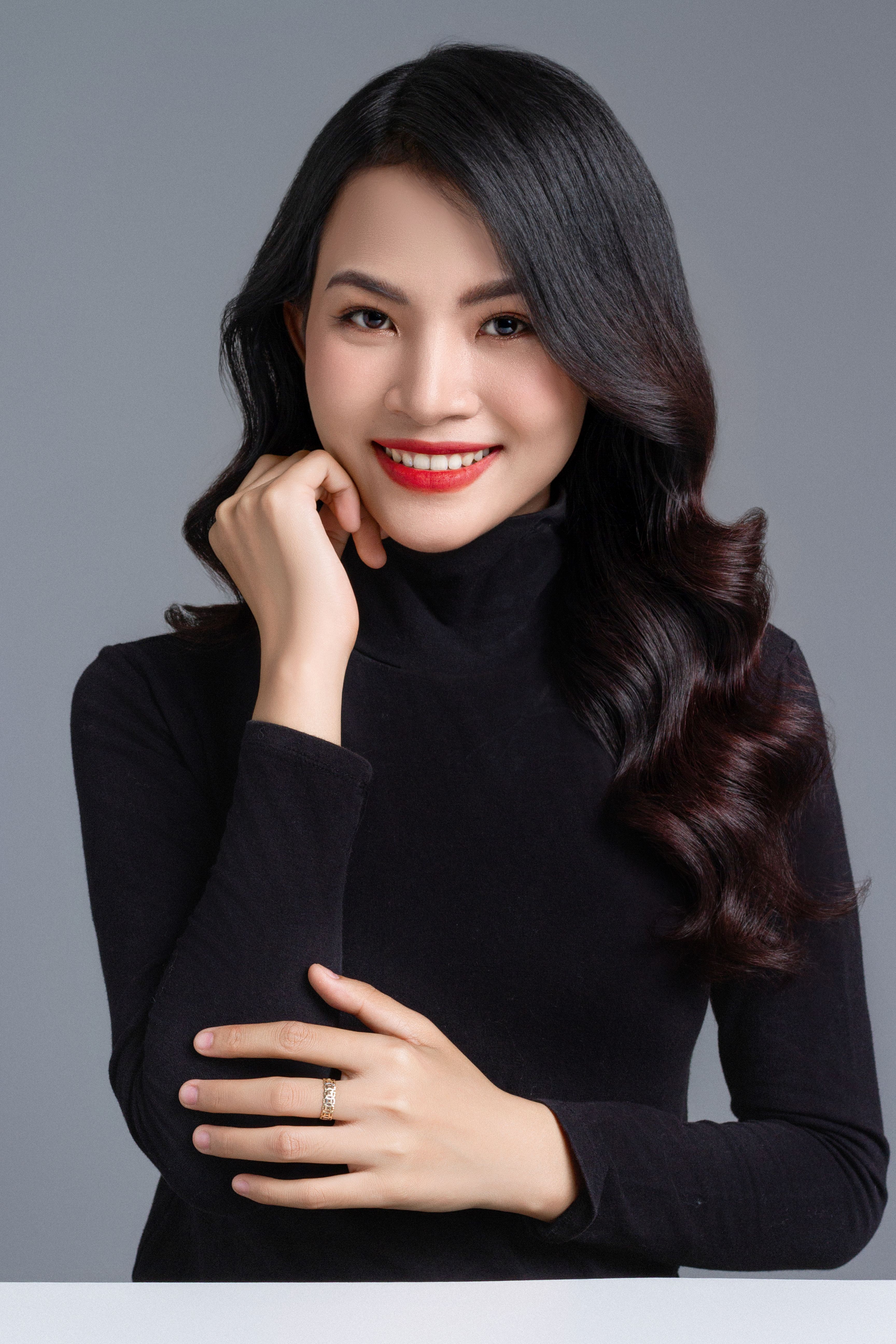 Smiling Model in Black Turtleneck · Free Stock Photo
