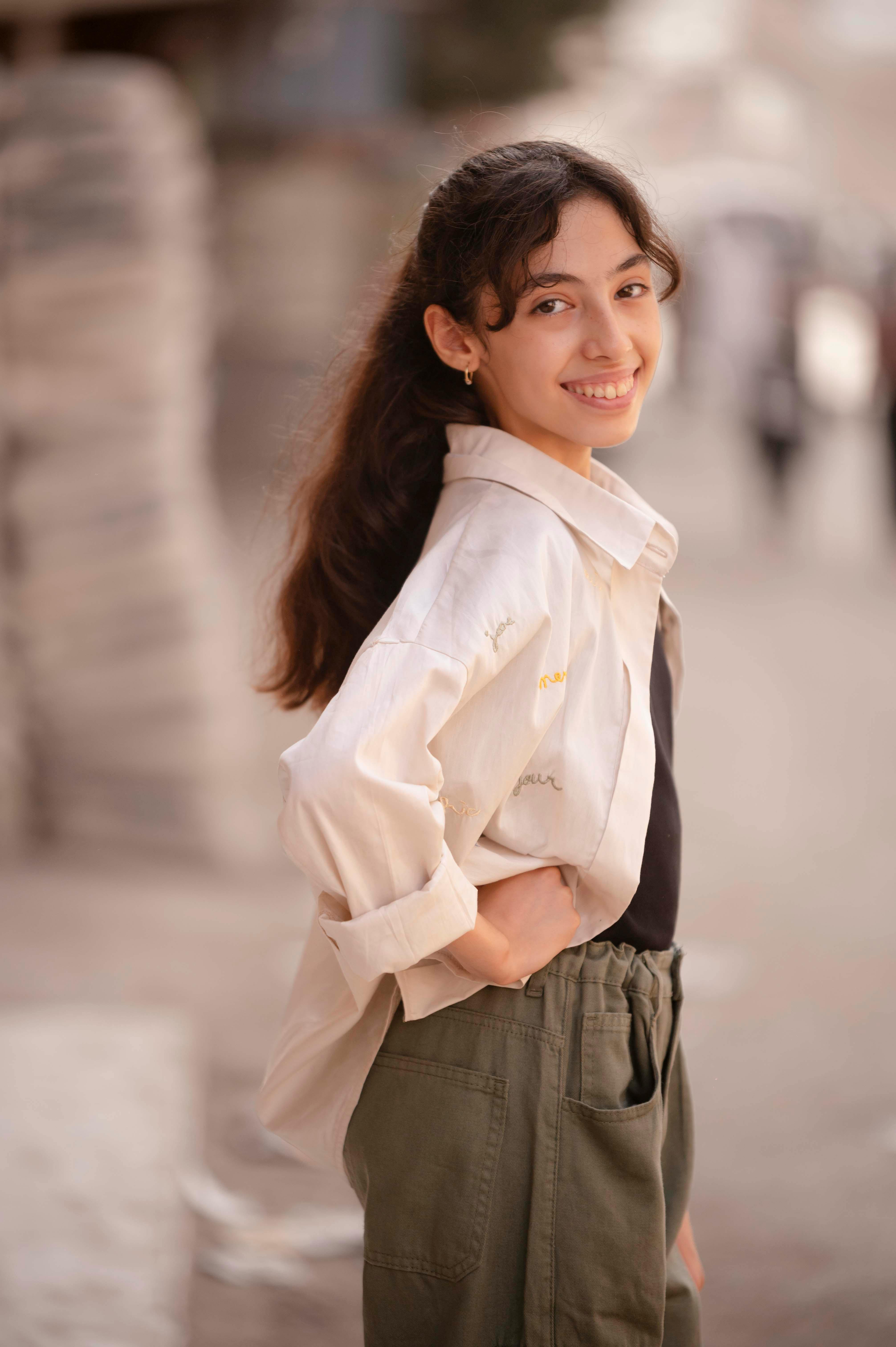 Smiling Woman Looking Back · Free Stock Photo