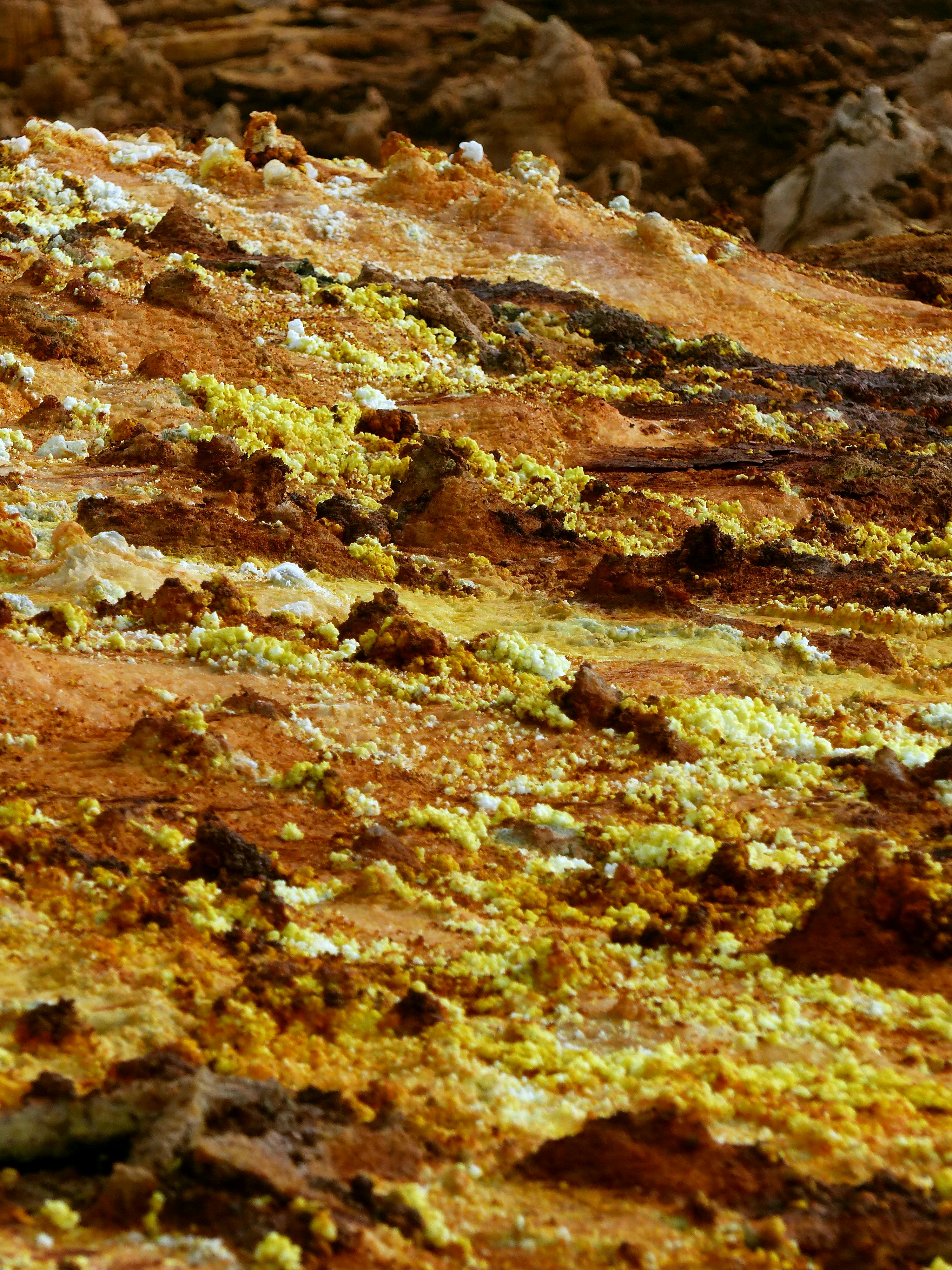 Sulfur Deposits on Red Rock · Free Stock Photo