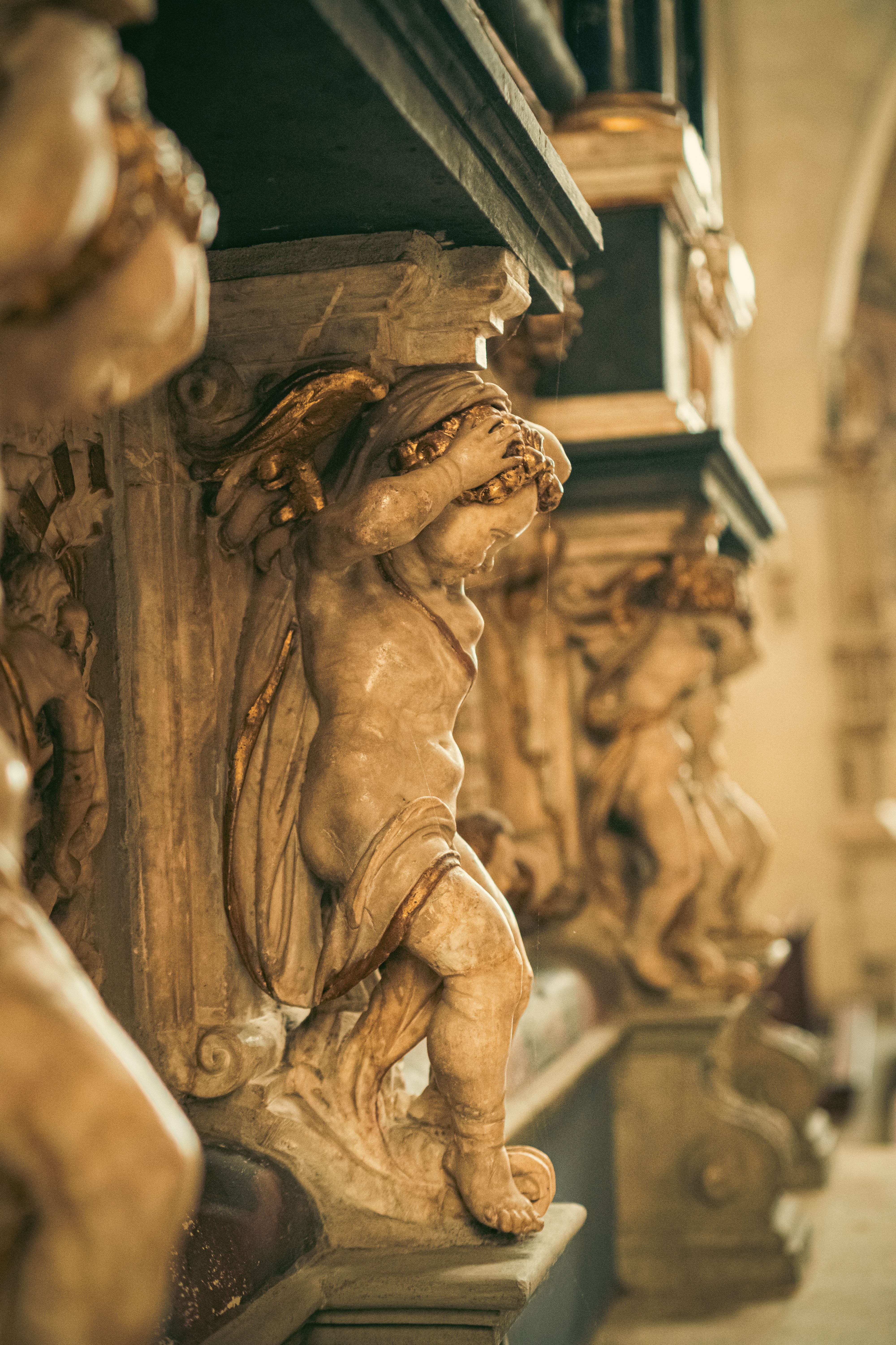 A close up of some statues in a church · Free Stock Photo