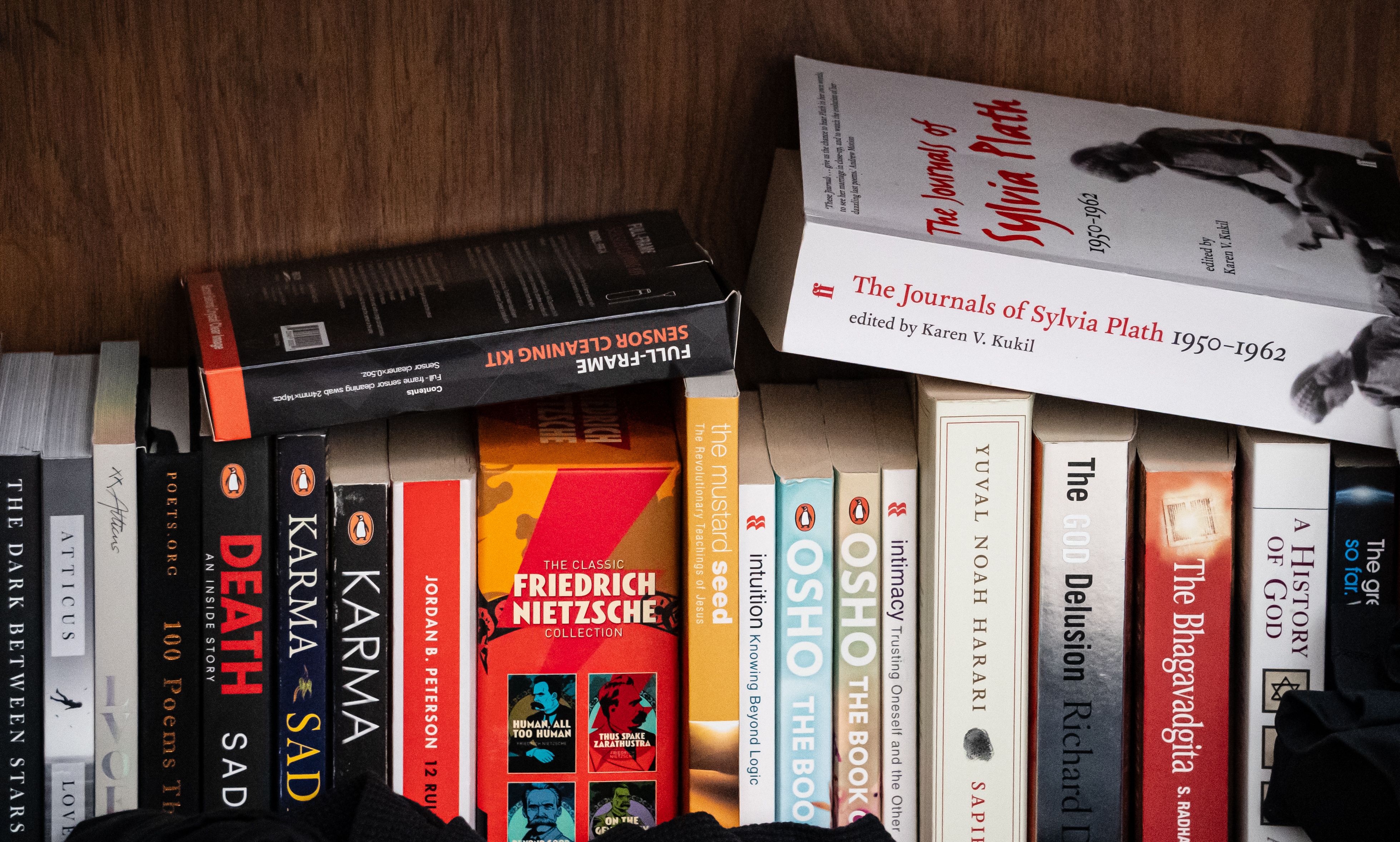 A collection of books on a shelf · Free Stock Photo