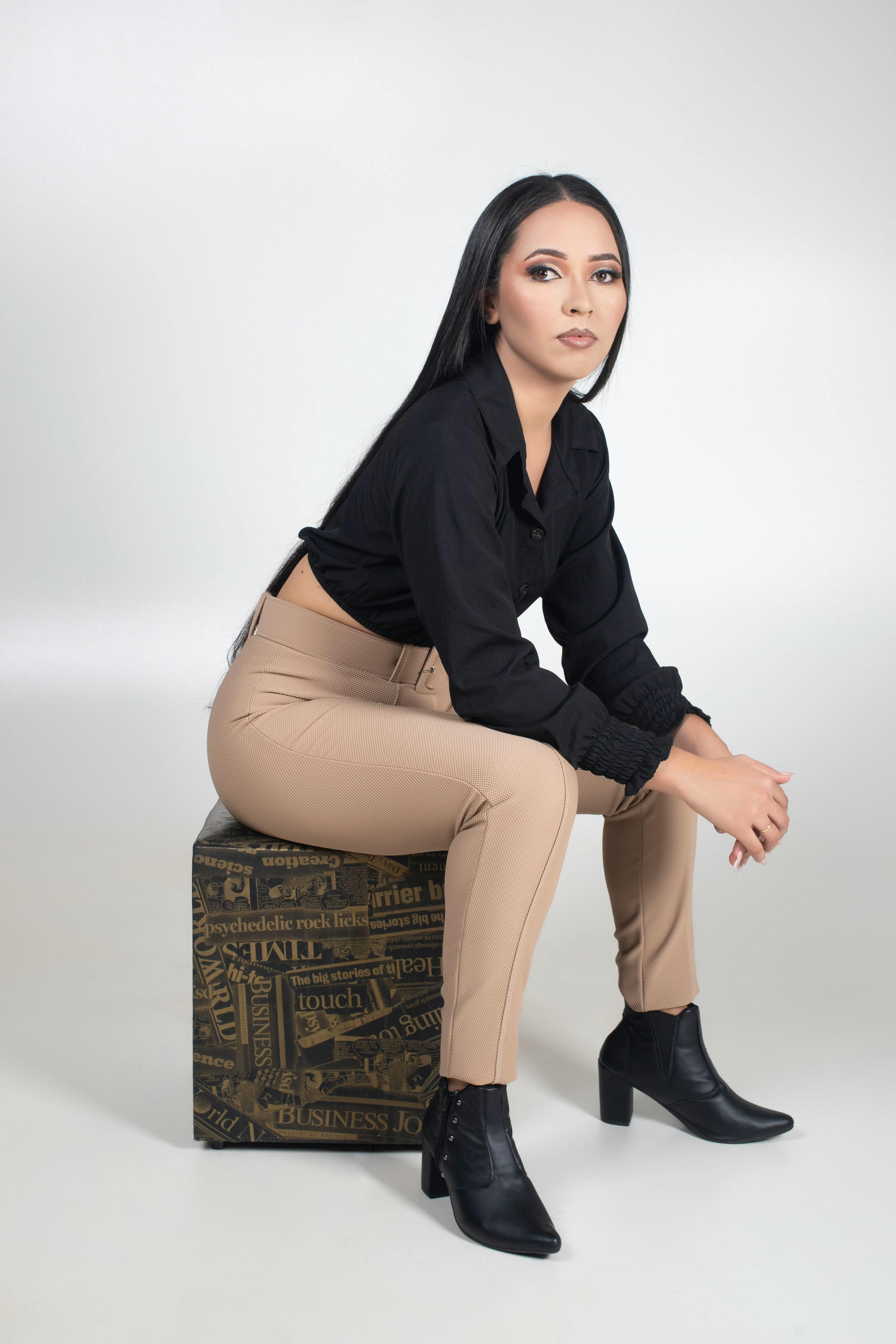 Brunette Woman Sitting on Box · Free Stock Photo