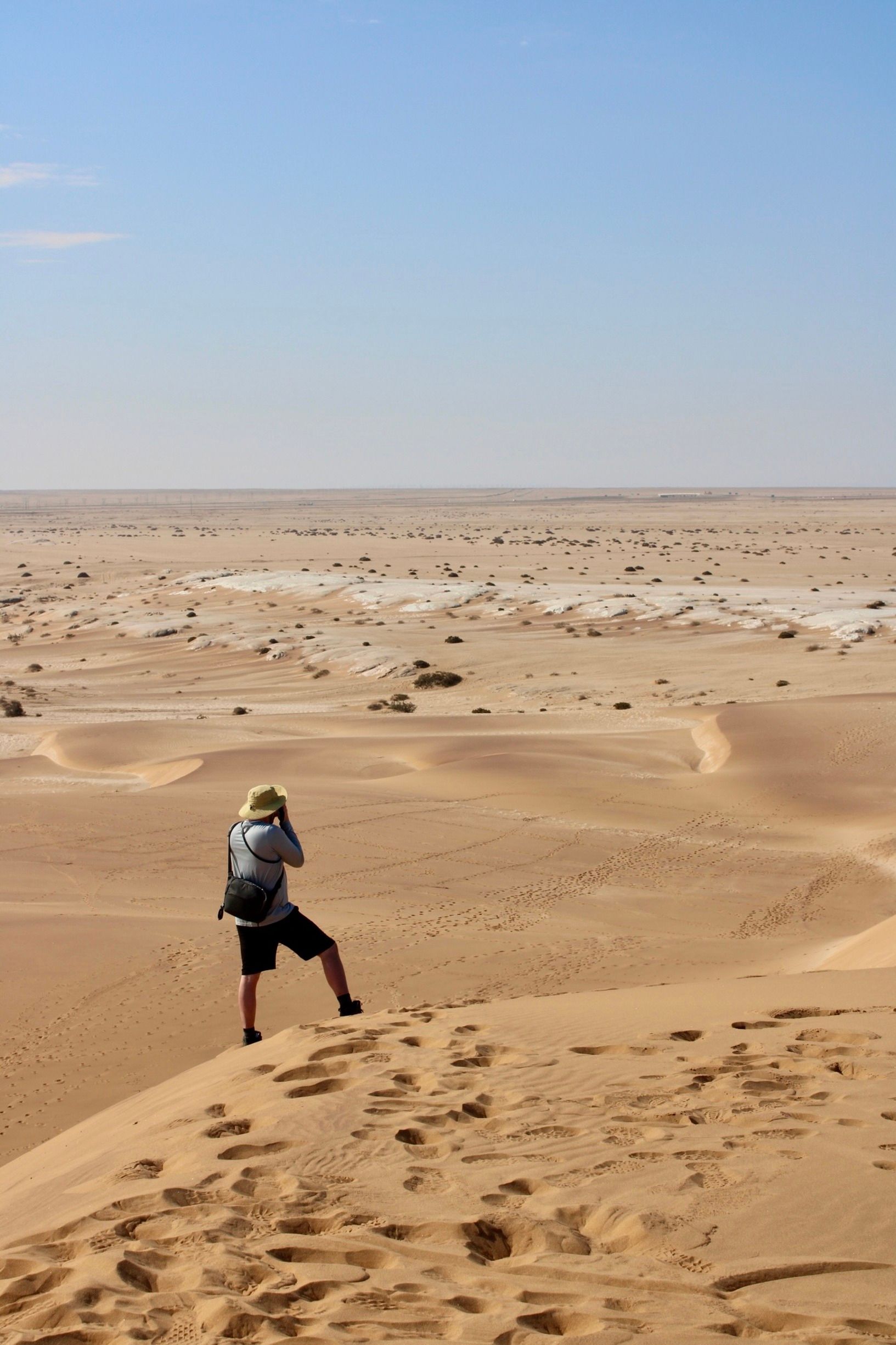 Back View of Man on Dune Observing Vast Desert around · Free Stock Photo